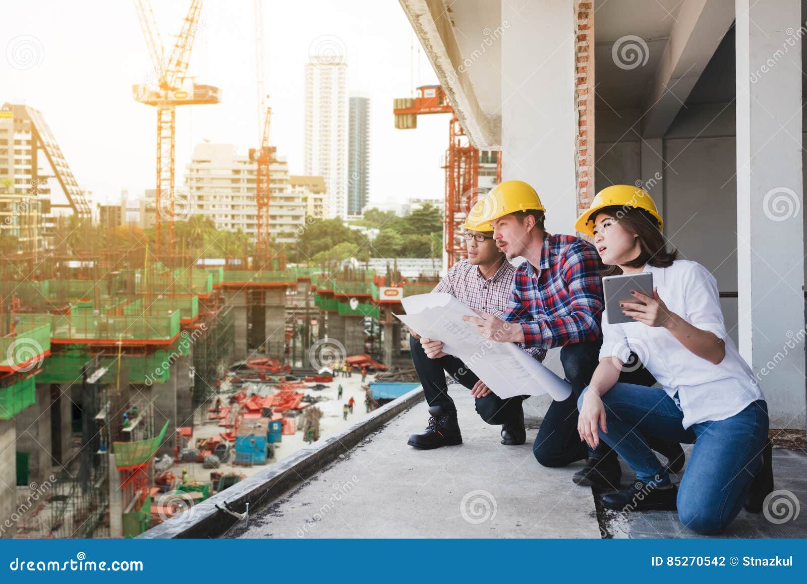 Three Construction Engineers Working Together in Construction Si Stock ...
