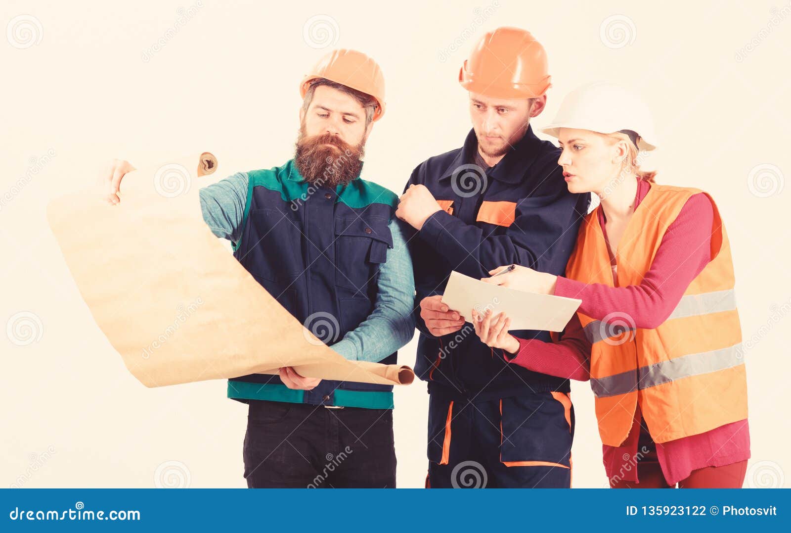 Three Construction Engineers Working Together, Planning for Renovation ...