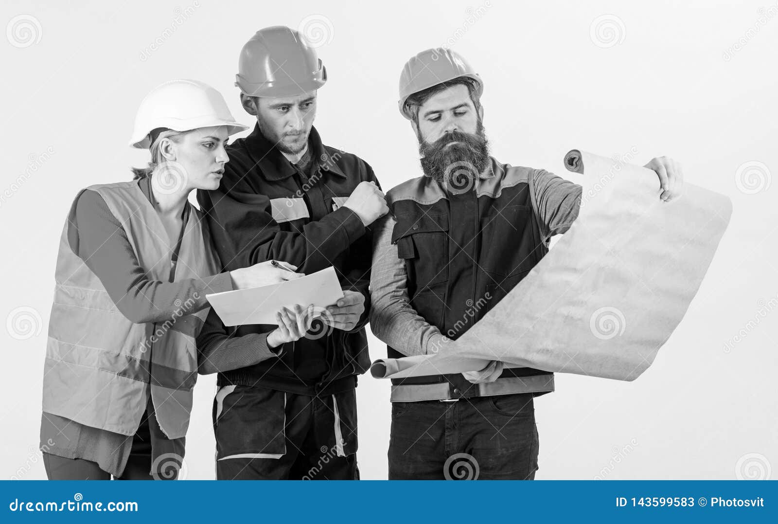 Three Construction Engineers Working Together, Planning for Renovation ...