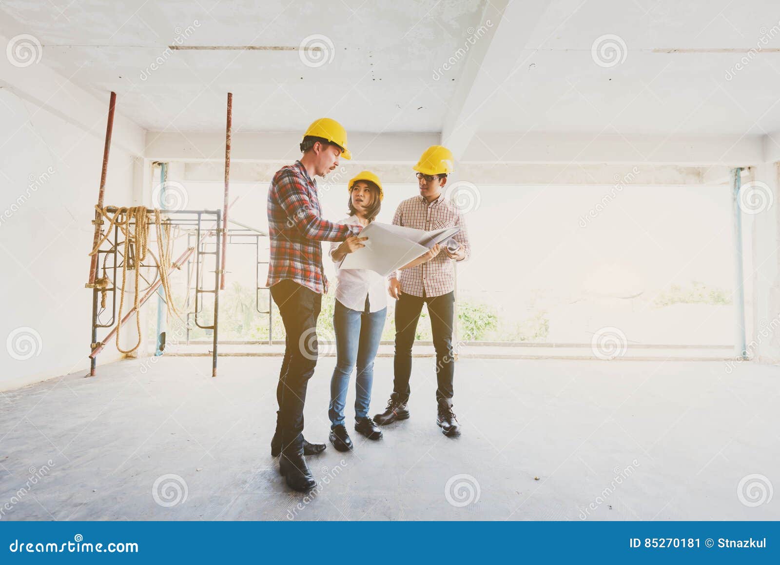 Three Construction Engineers Working Together in Side Building P Stock ...