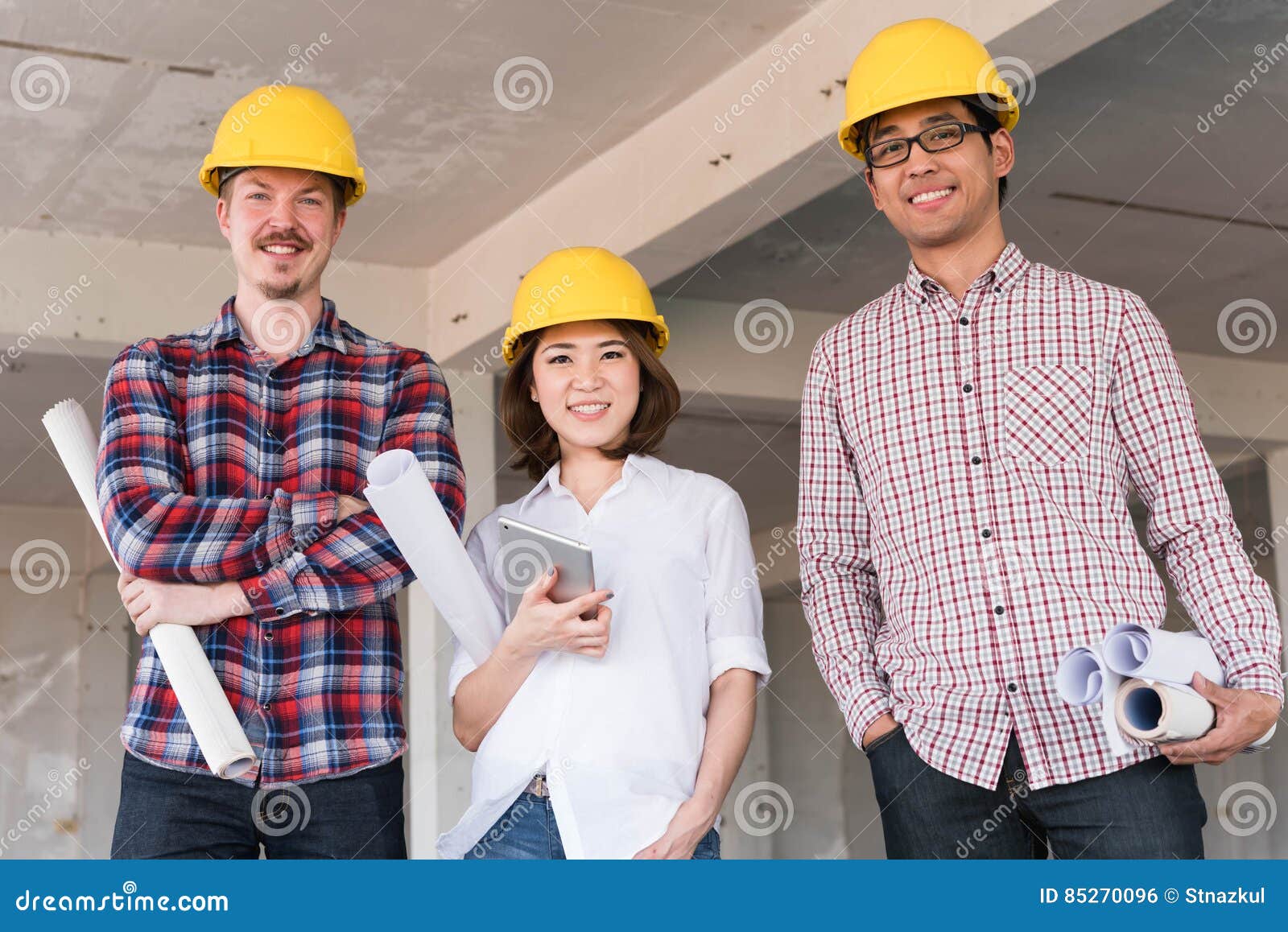 Three Construction Engineers Working Together in Construction Si Stock ...
