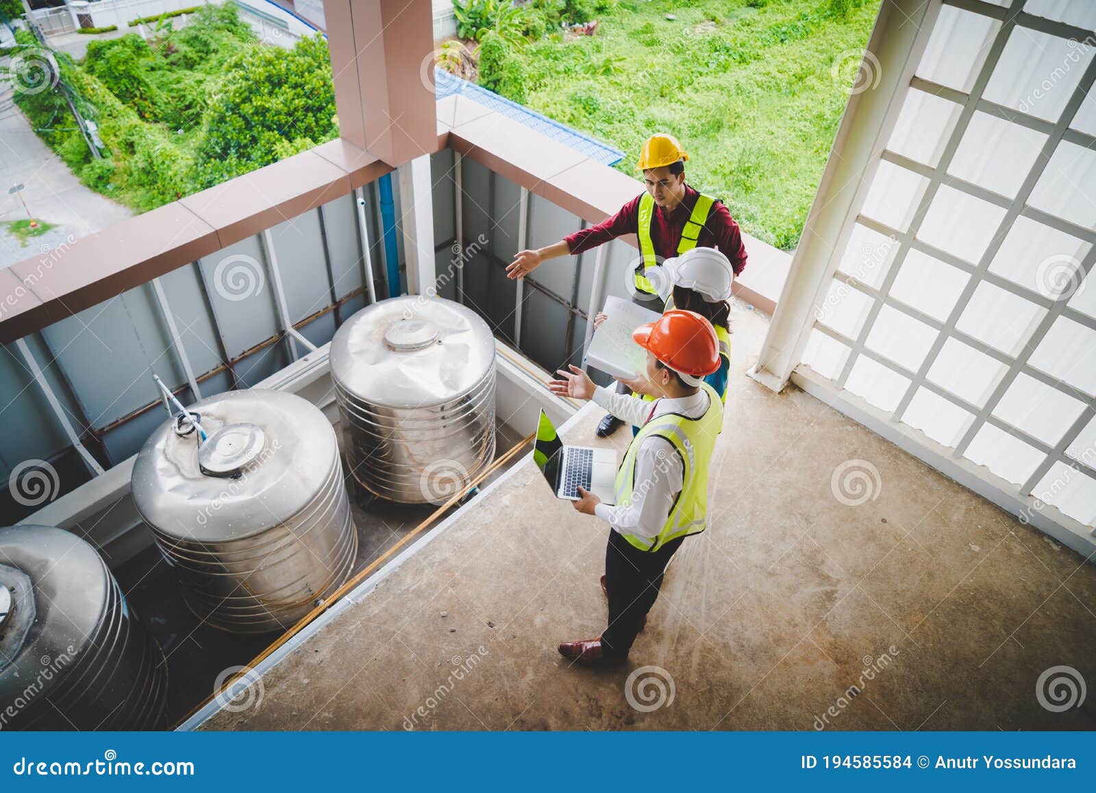 Three Contractor Engineer Worker is Checking the Water System of an ...