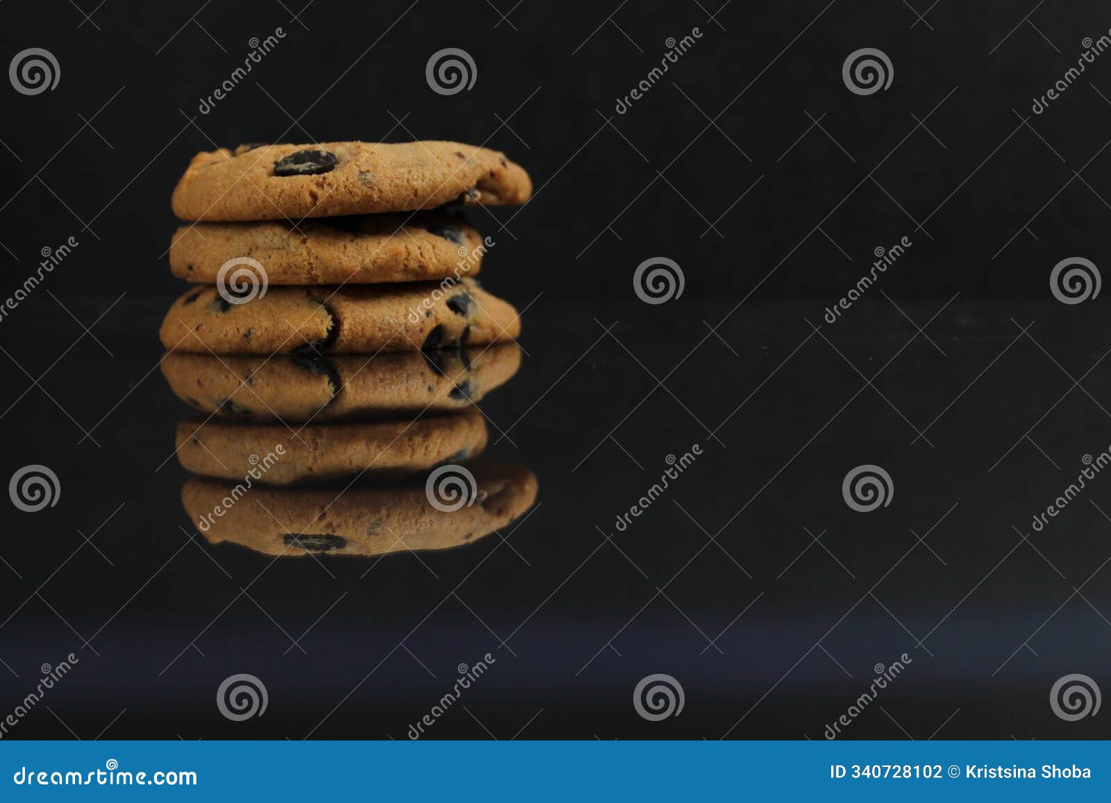 Three Cookies are Reflected on a Black Background. Optical Illusion ...