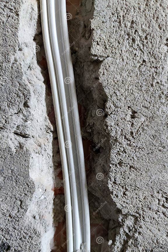 Three-core Electrical Cable in a Groove in a Concrete Wall Stock ...