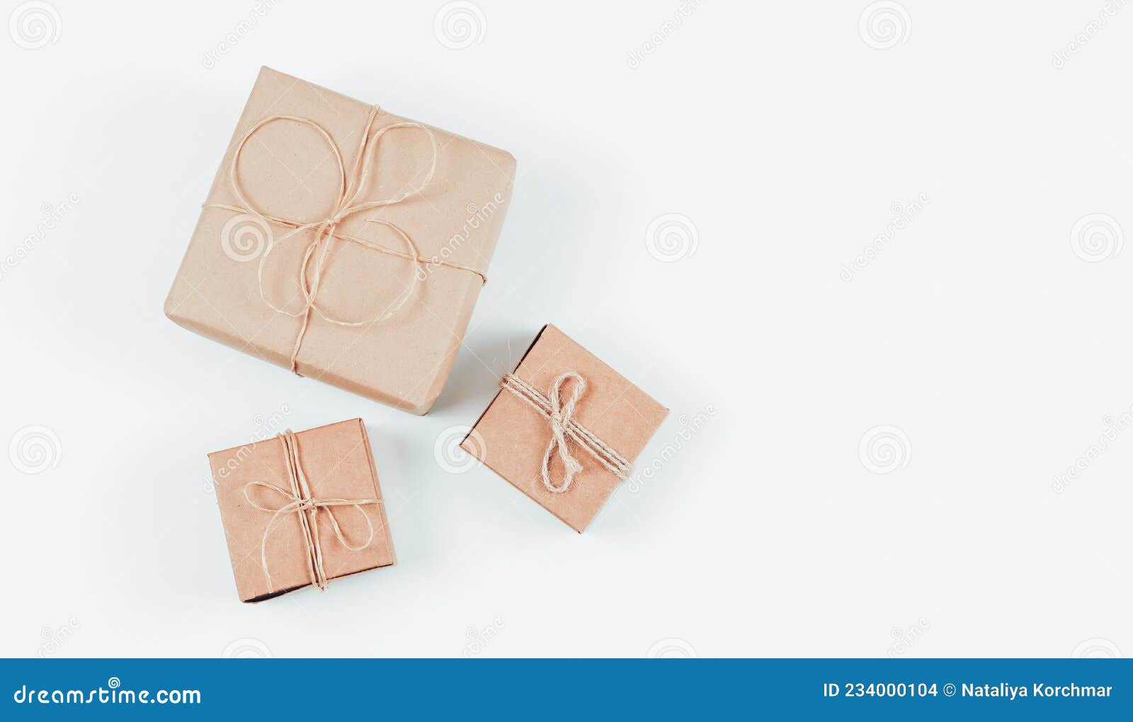 Three Craft Gift Boxes with Jute Thread Lie on the Left Against a White ...
