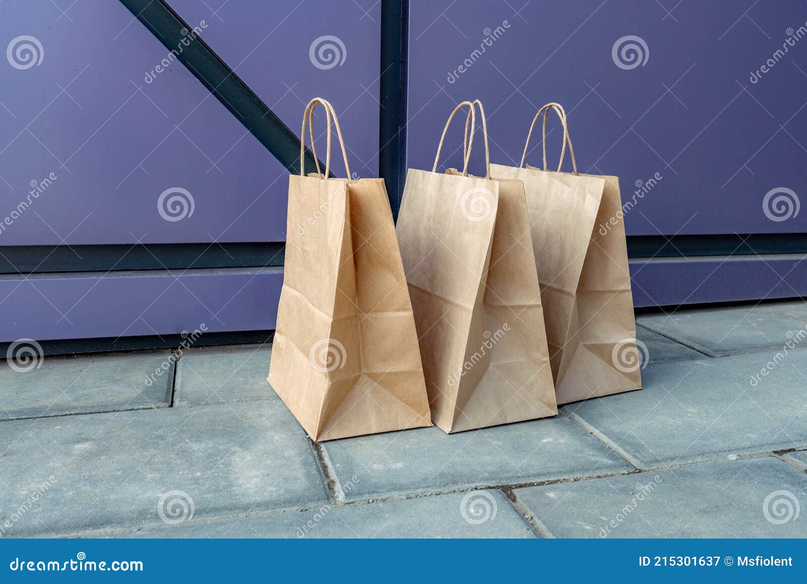 Three Craft Paper Bags on a Purple Wall Background Stock Image - Image ...