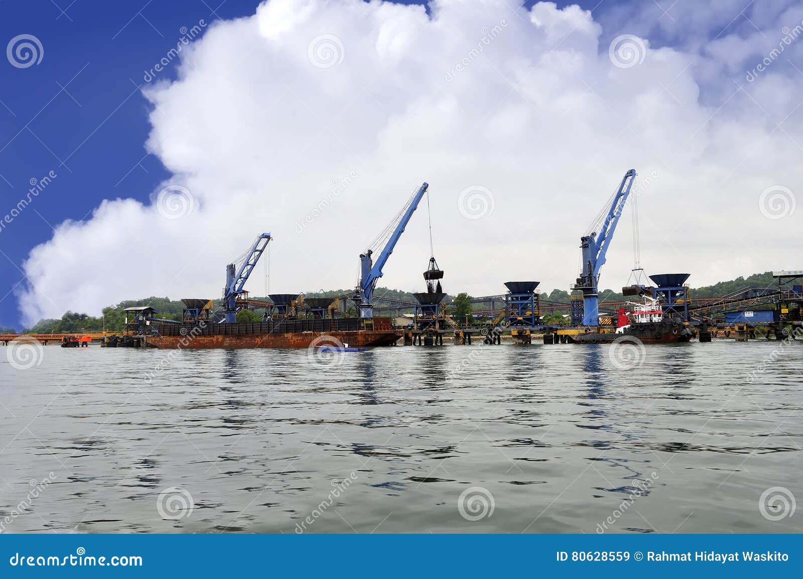 Three Crane Unloading Coal from Barge To Hopper Stock Image - Image of ...