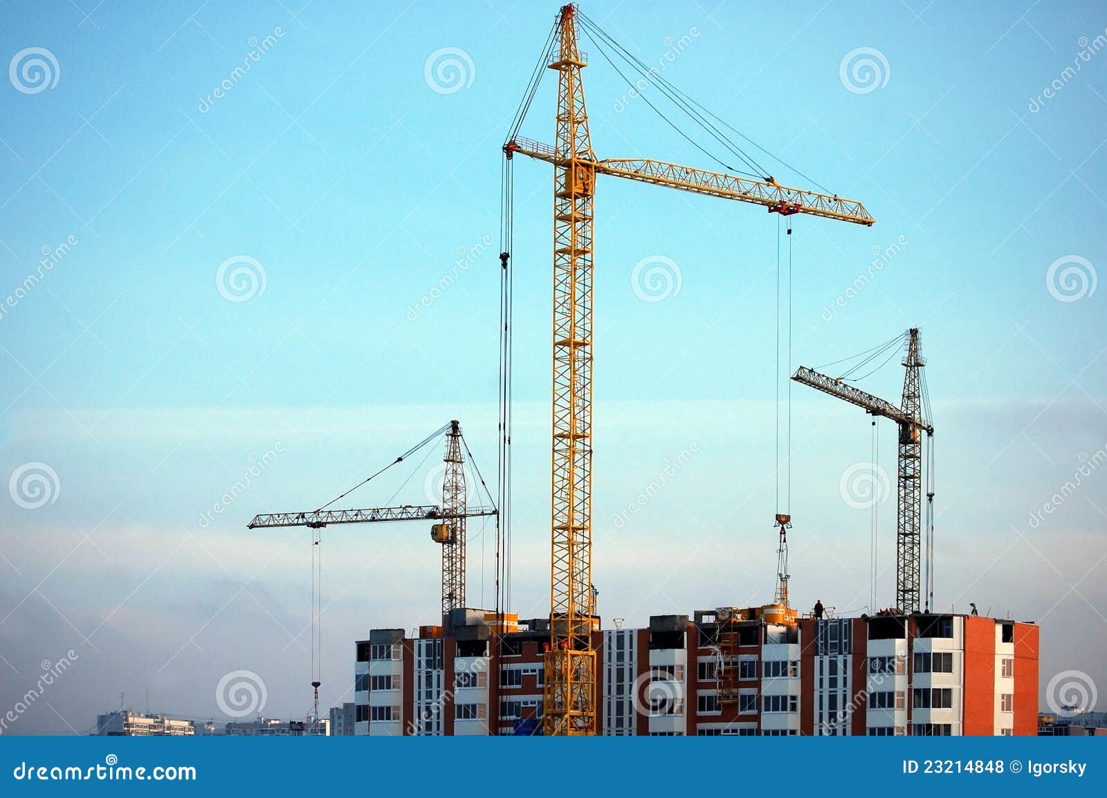 , Three Cranes on Top of High-rise Building Stock Photo - Image of ...