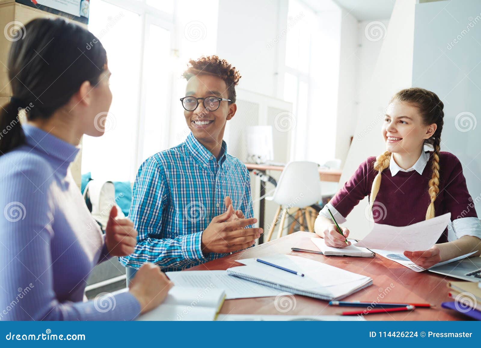 Students discussing ideas stock photo. Image of intercultural - 114426224