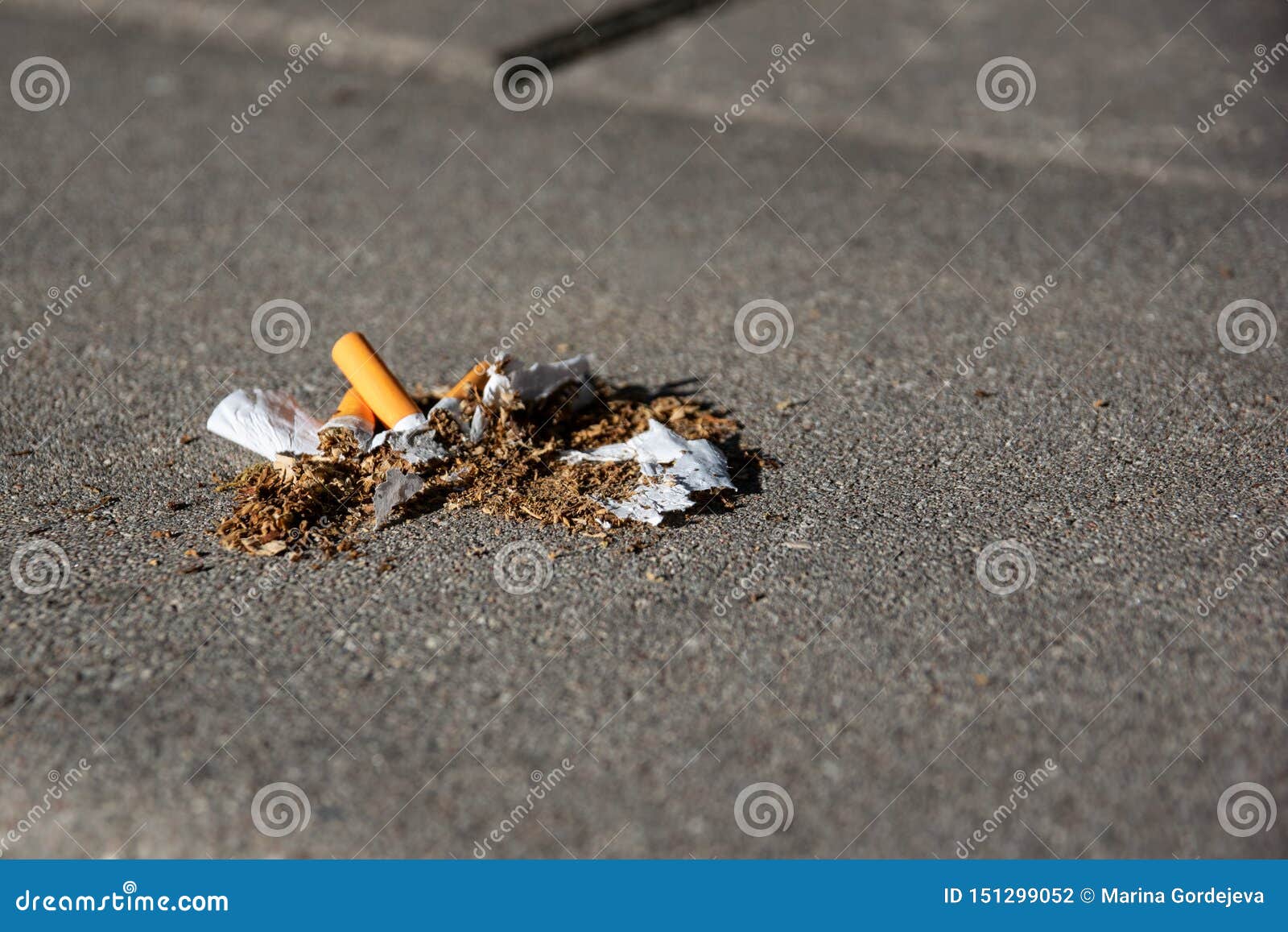 Three Crushed Cigarettes Lying on the Pavement Stock Photo - Image of ...