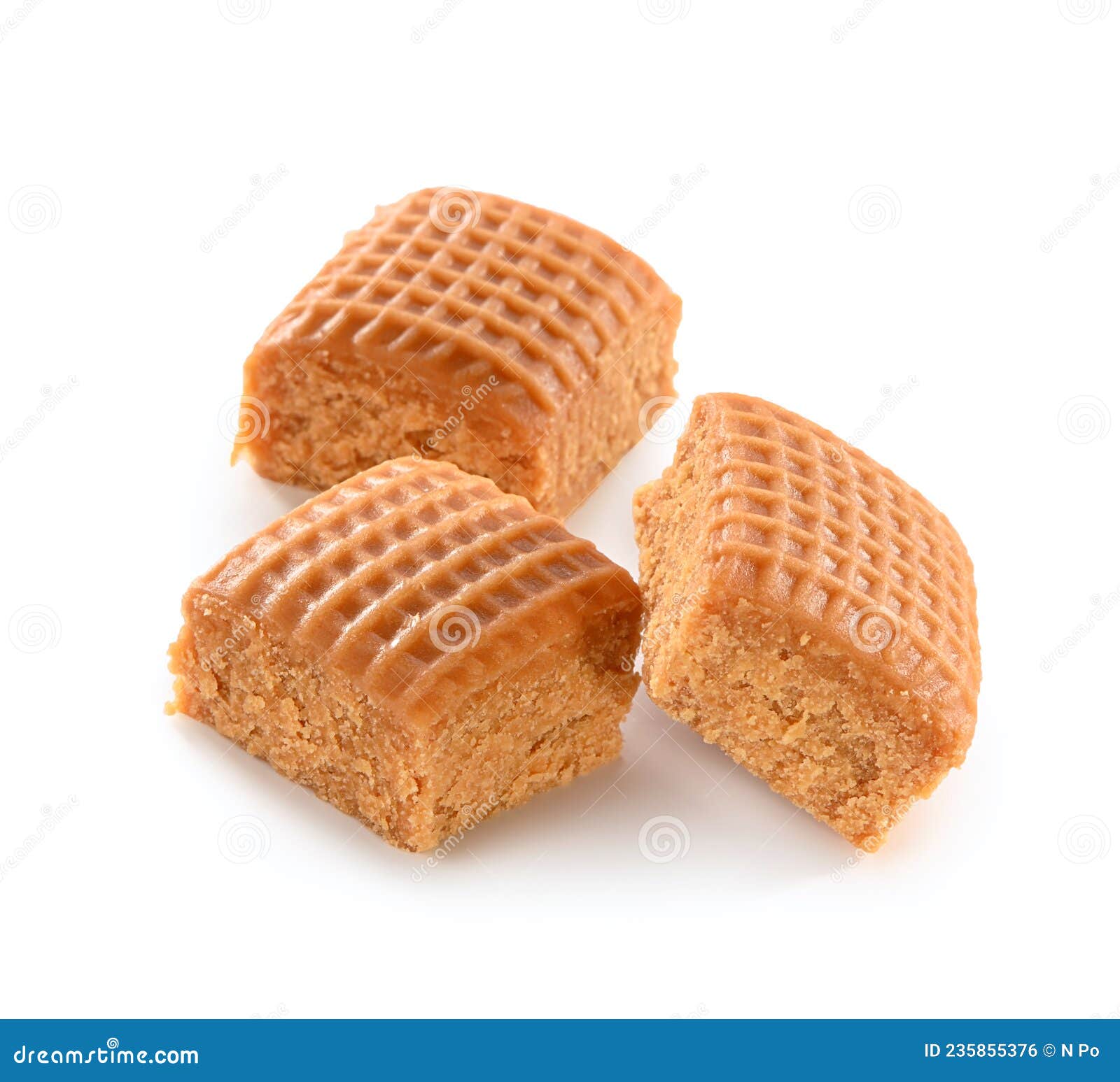 Three Cubes of Checkered Creamy Toffee Close-up Isolated on White ...
