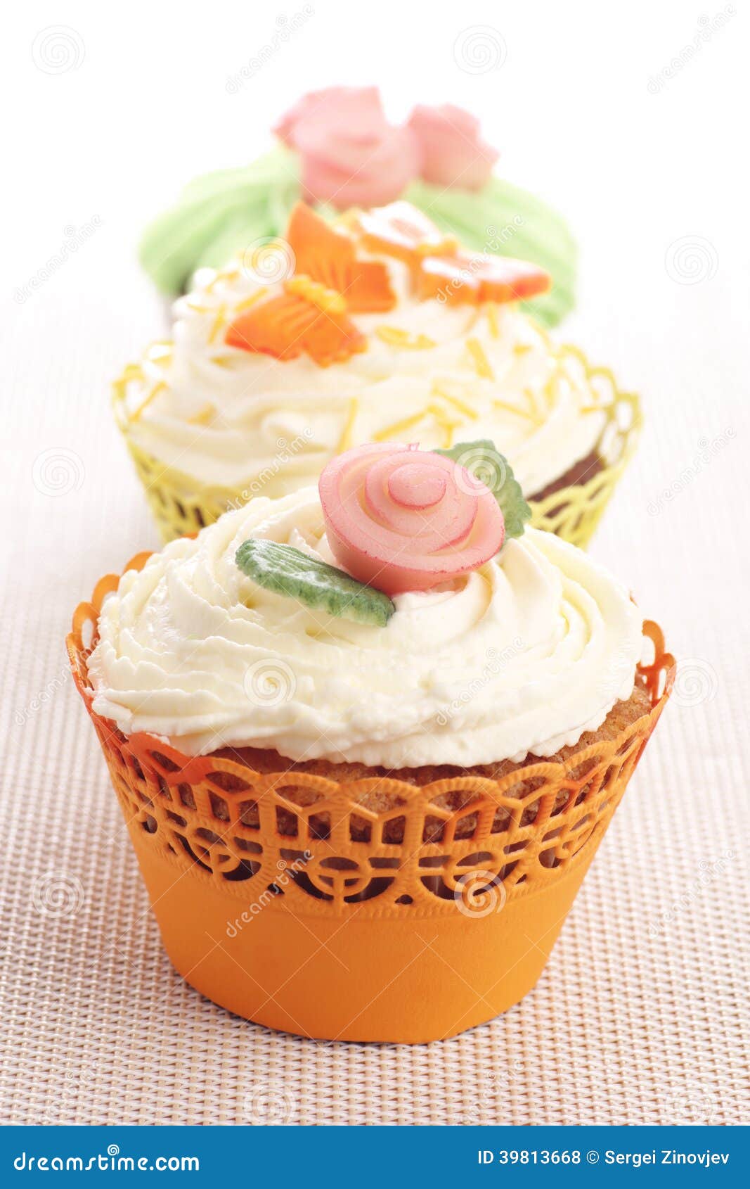 Three Cupcakes Decorated with Marzipan Decorations Stock Photo - Image ...