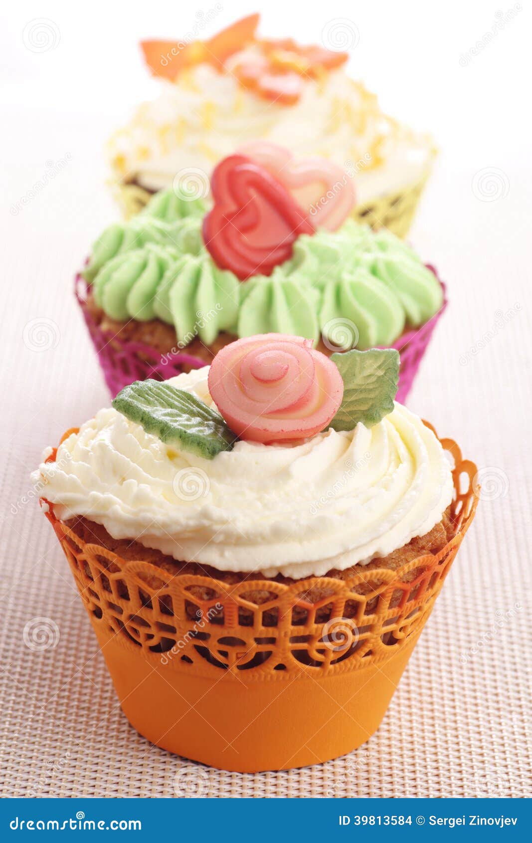 Three Cupcakes with Marzipan Decorations. Stock Photo - Image of cream ...