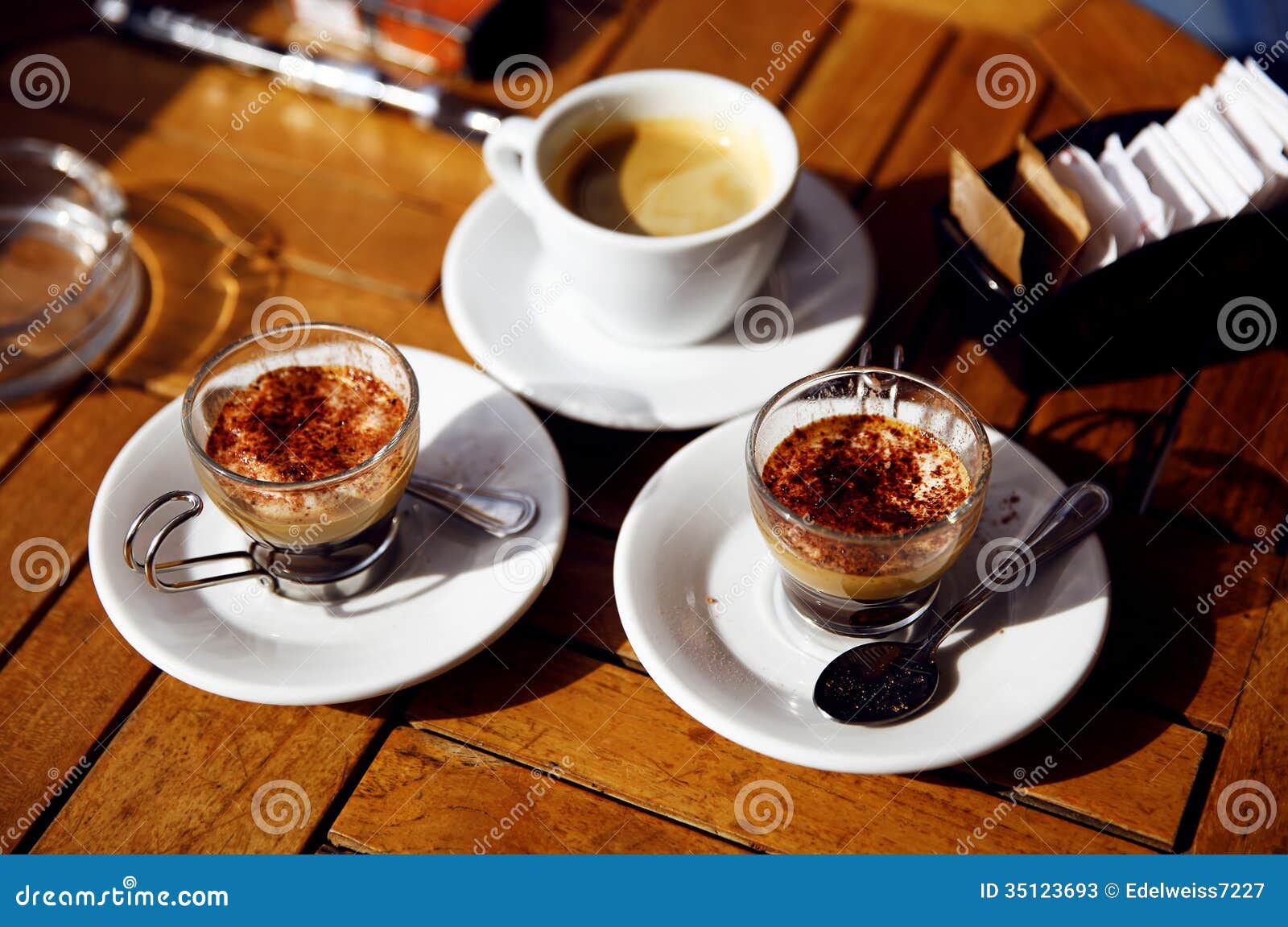 Three Cups of Coffee on a Wooden Table Stock Image - Image of ...