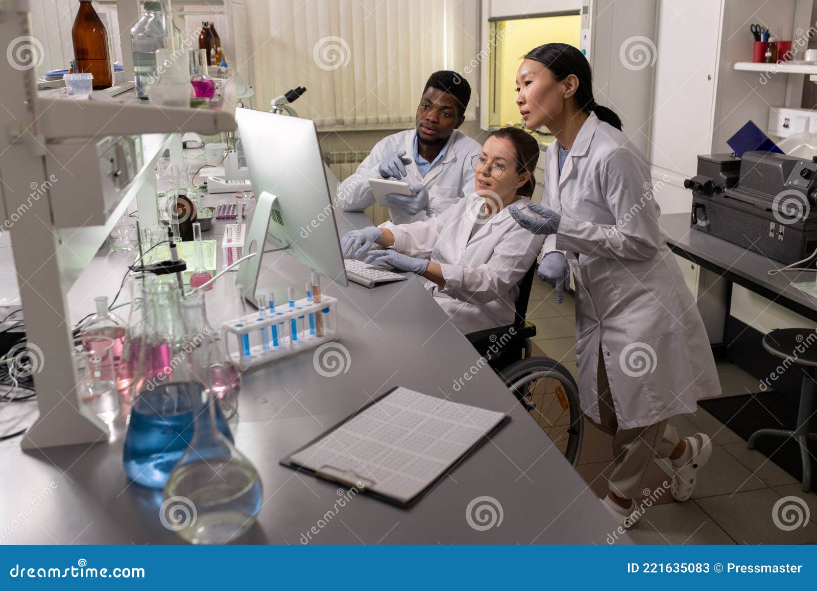 Three Curious Scientists Looking at Computer Screen Stock Image - Image of laboratory ...