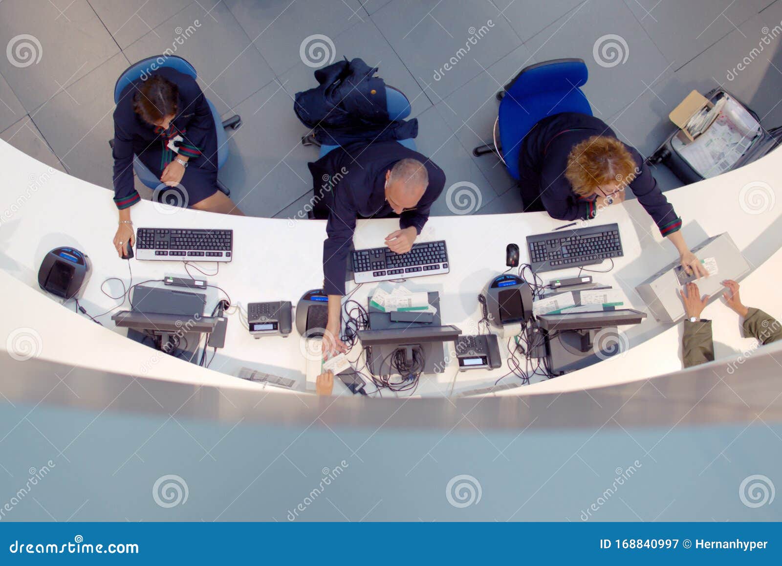Three Customer Service Agents Working at a Help Desk Editorial ...