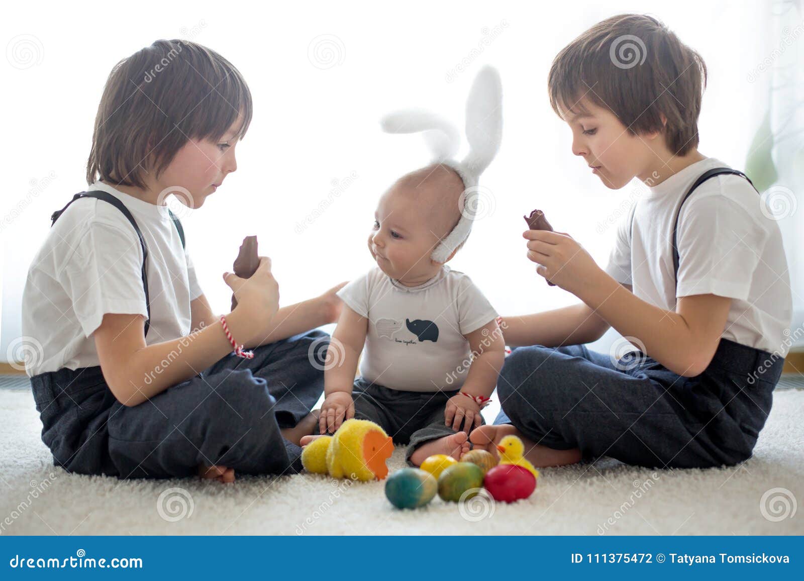 Three Cute Boys, Siblings, Brothers, Playing with Easter Eggs, E Stock ...