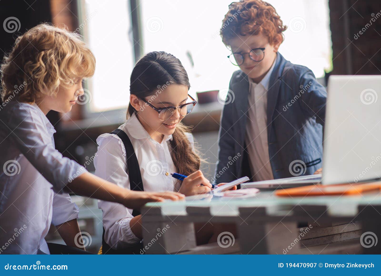 Three Cute Kids Working on Lessons Together and Looking Involved Stock ...