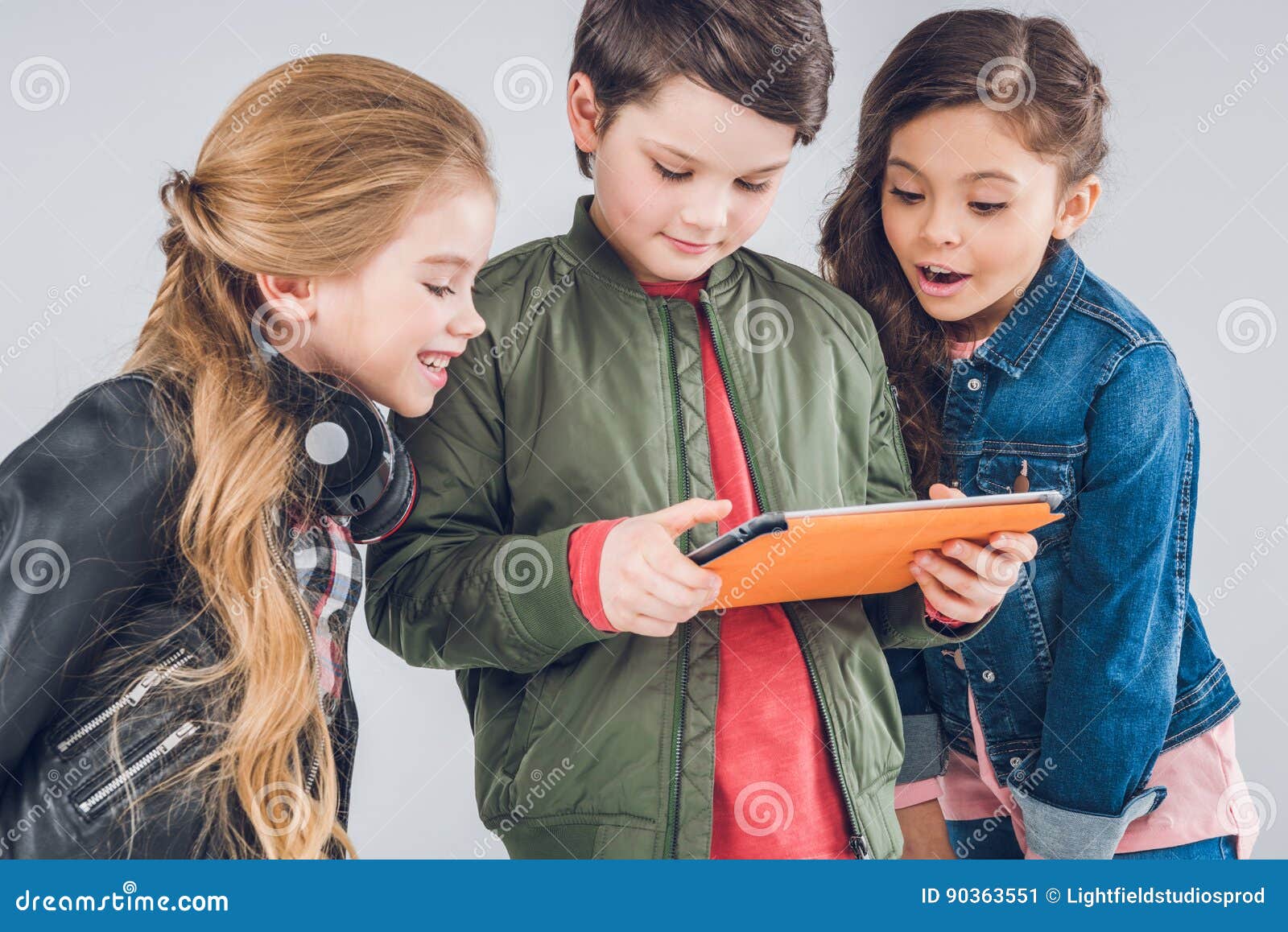 Three Cute Little Kids Using Digital Tablet Together Stock Image ...