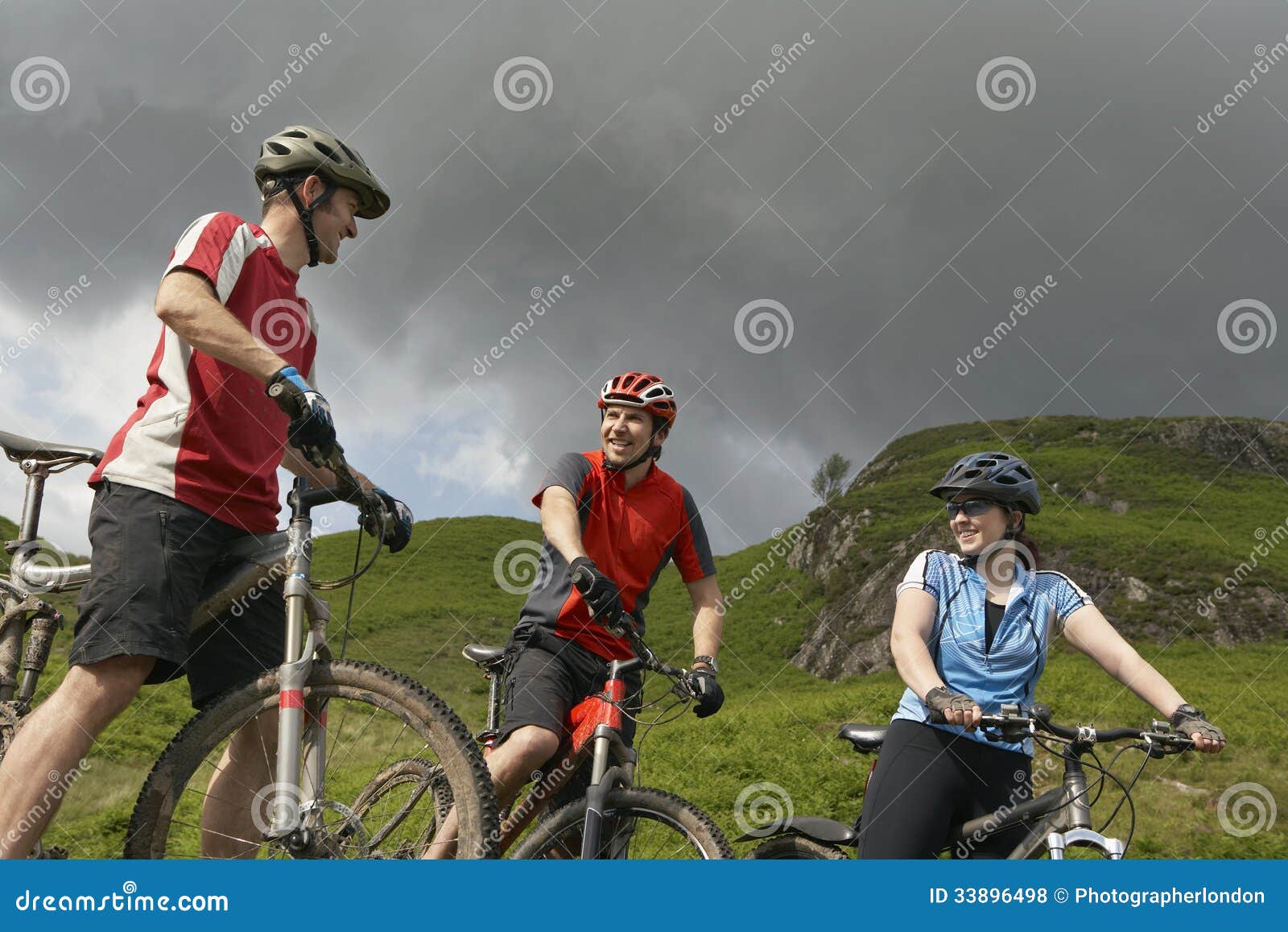 Three Cyclists in Countryside Stock Photo - Image of adventure, cycling ...