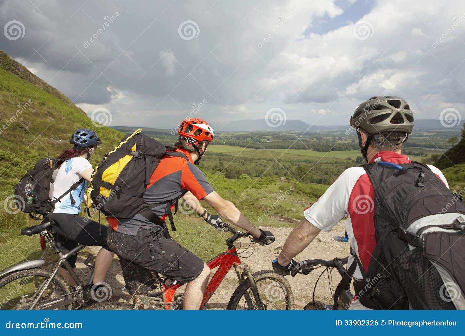 Three Cyclists on Countryside Track Stock Photo - Image of direction ...