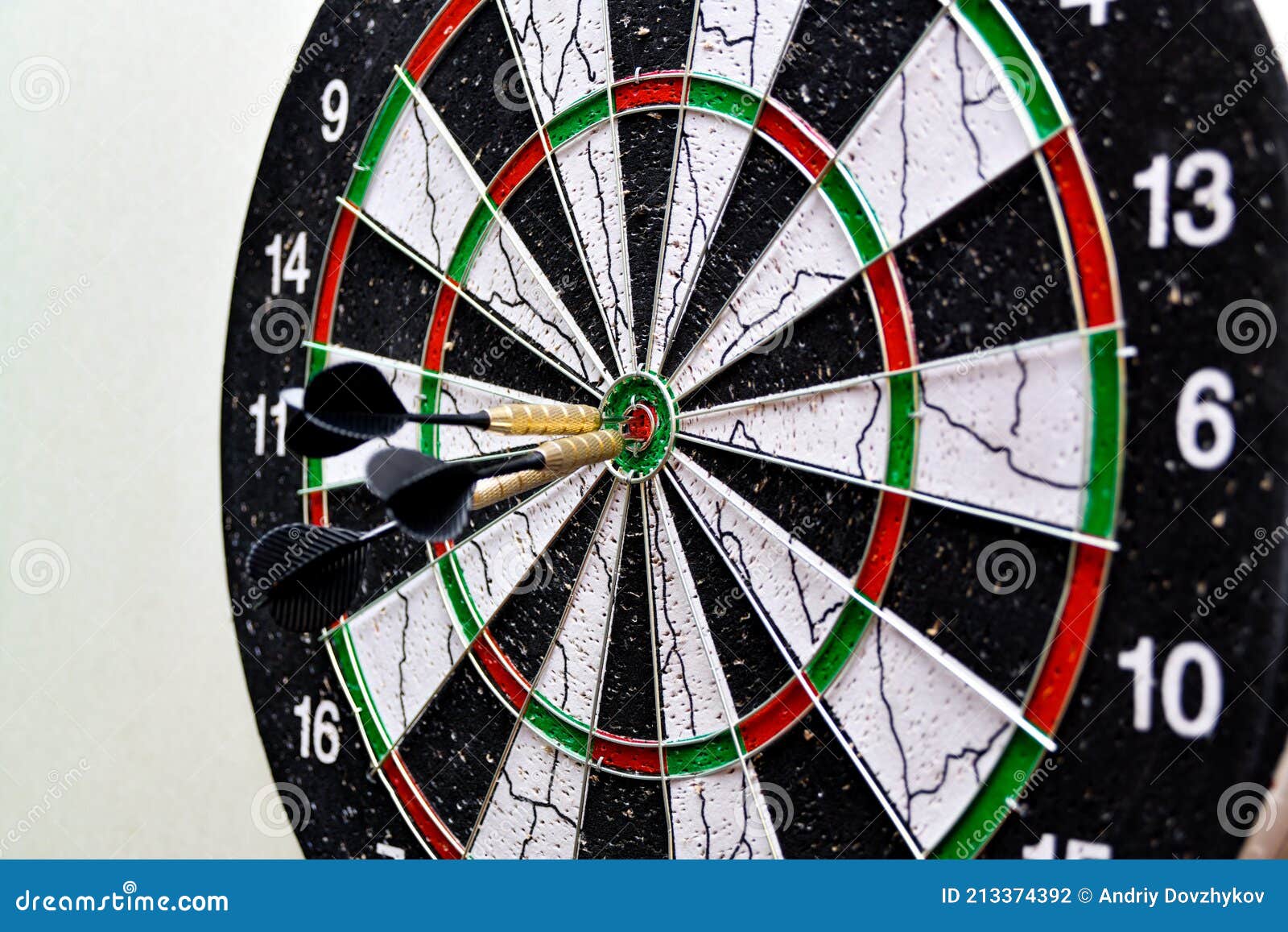 Three Darts Hit the Center of the Board while Playing Darts Stock Photo ...