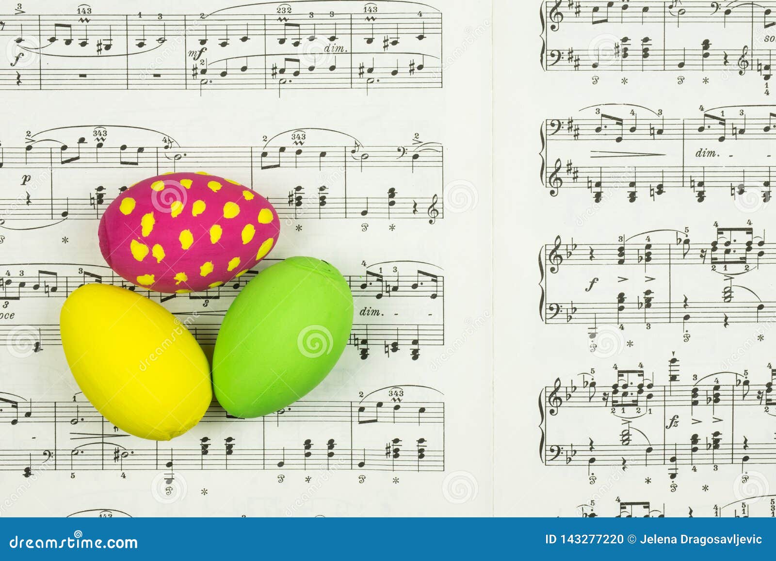 Three Decorative Painted Easter Eggs on Sheet with Music Notes As ...