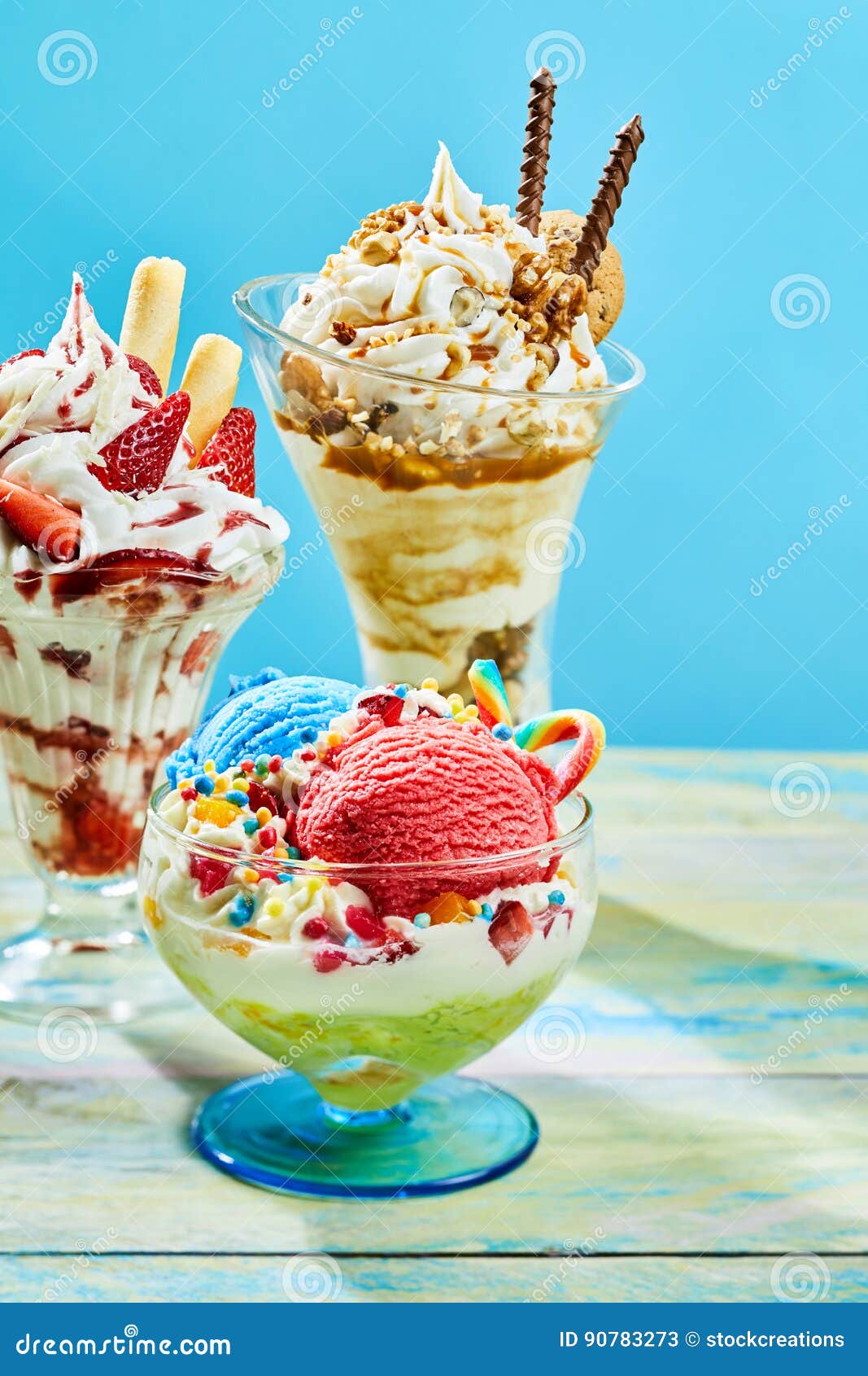 Three Delicious Ice Cream Sundaes on Table Stock Image - Image of ...