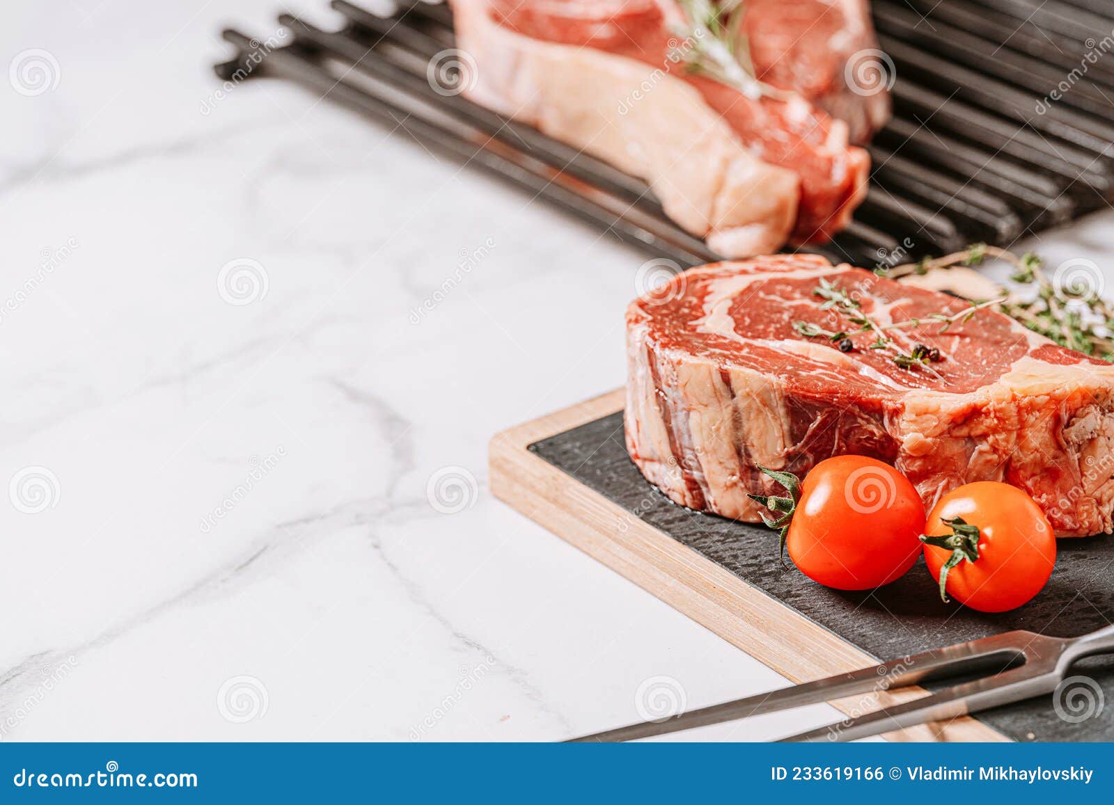 Three Delicious Steaks Ready To Grill on a White Marble Surface Stock ...