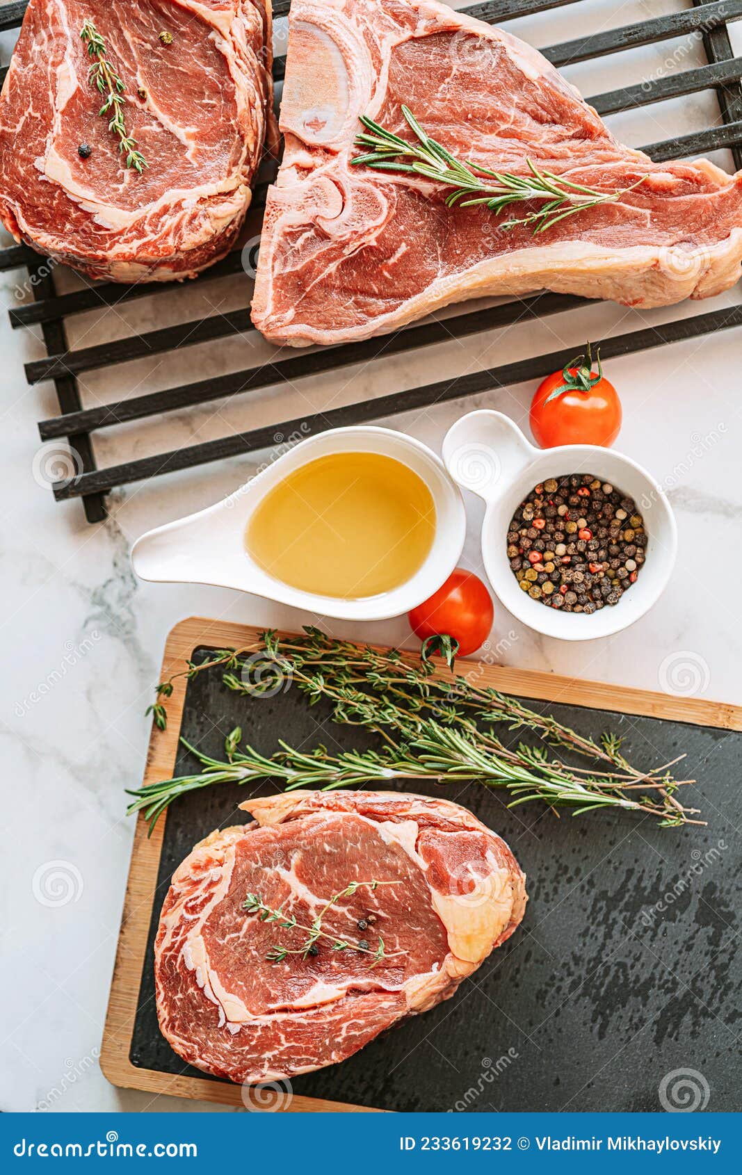 Three Delicious Steaks Ready To Grill on a White Marble Surface Stock ...