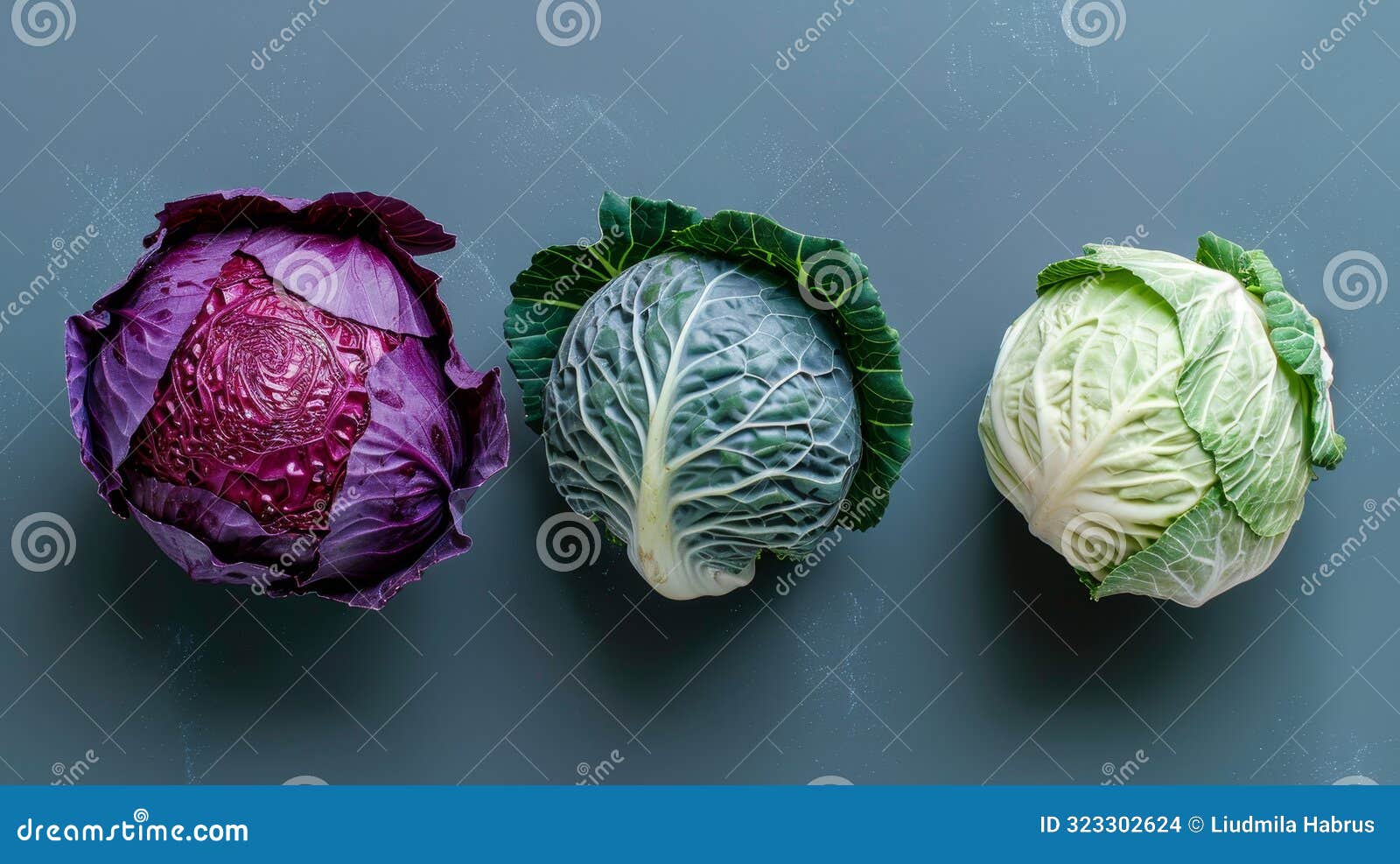 Three Different Colored Cabbage Heads are Shown on a Table Stock Photo ...