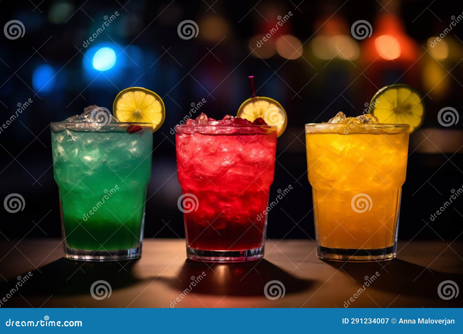Three Different Colored Cocktails on the Bar Counter with Ice Spread ...