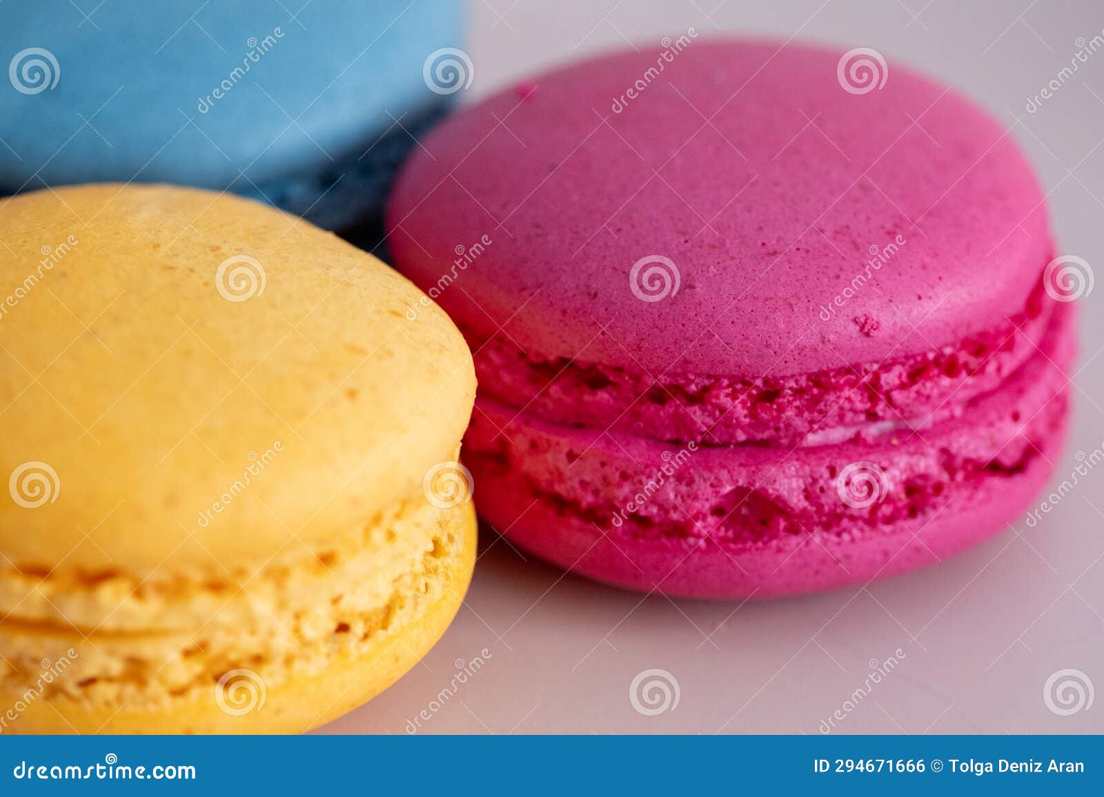 Three Different Colored Macarons on a Pink Plate Stock Photo - Image of ...