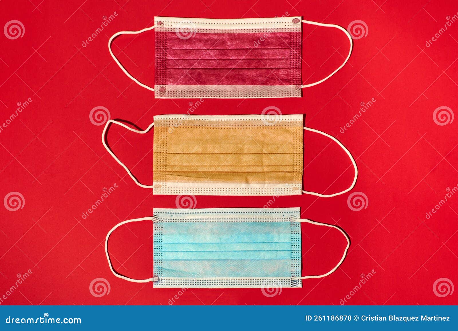 Three Different Colored Masks on a Red Background Stock Photo - Image ...