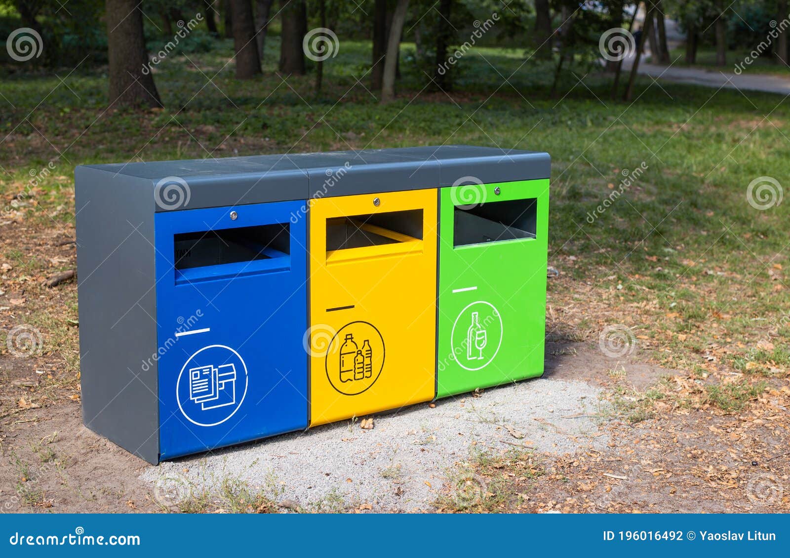 Three Different Garbage Container for Sorting Waste in the Park. Yellow ...