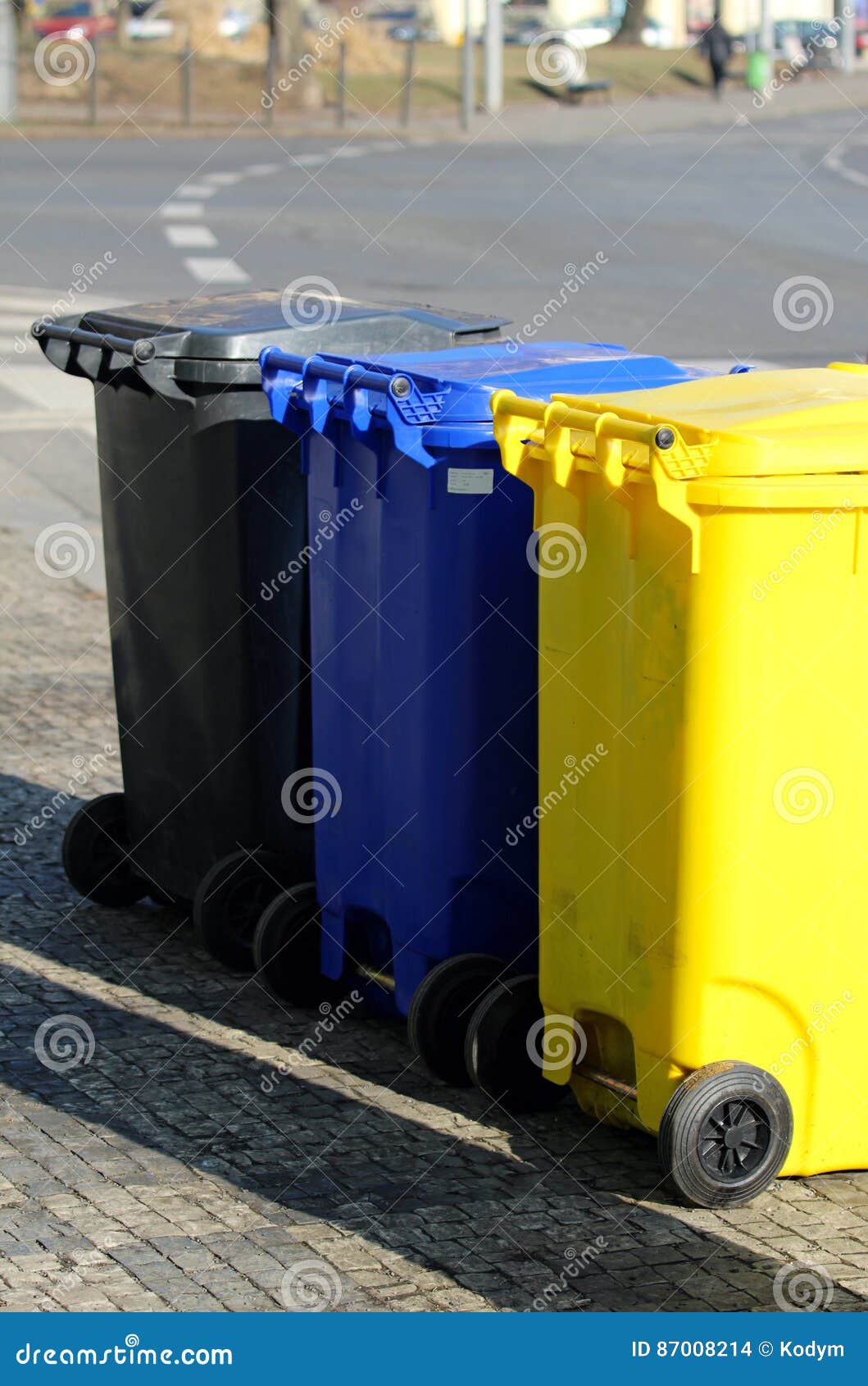 Three Different Multicolored Dustbins on the Street Stock Photo - Image ...