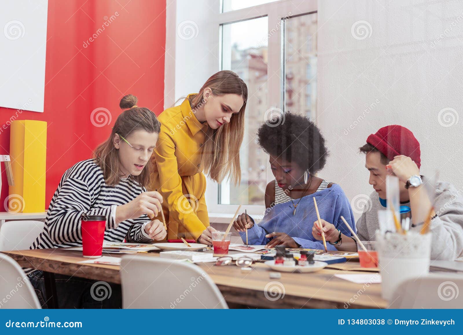 Three Diligent Students of Art Department Working Hard at the Class ...