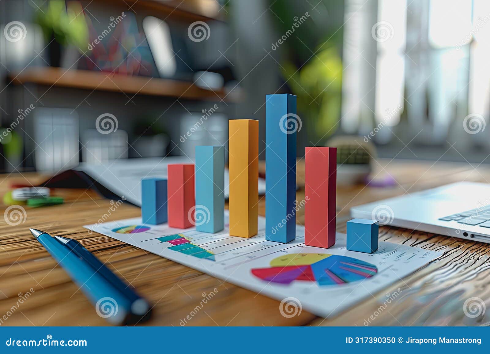 Three Dimensional Mockup Charts Showing Financial Data and Business ...