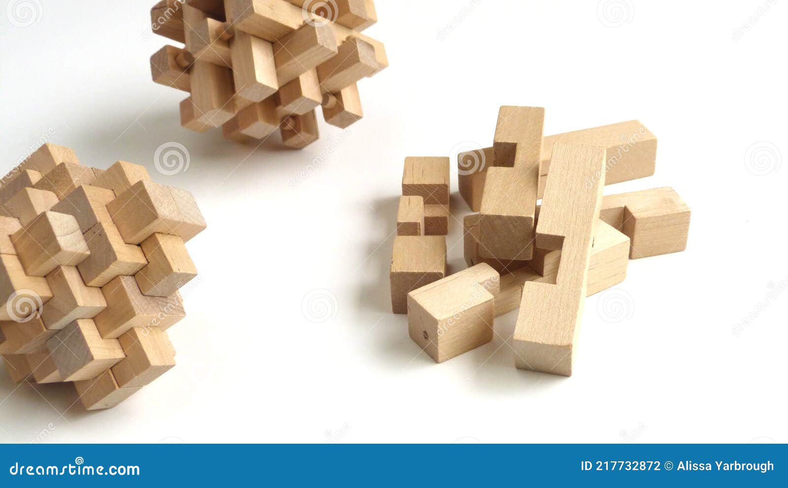 Three-Dimensional Wooden Puzzles on a White Background Stock Photo ...