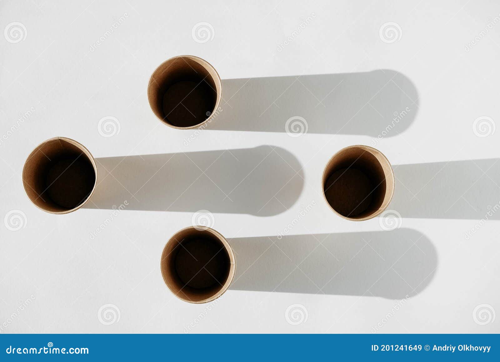 Three Disposable Paper Cup with Shadow from Light on a White Background ...