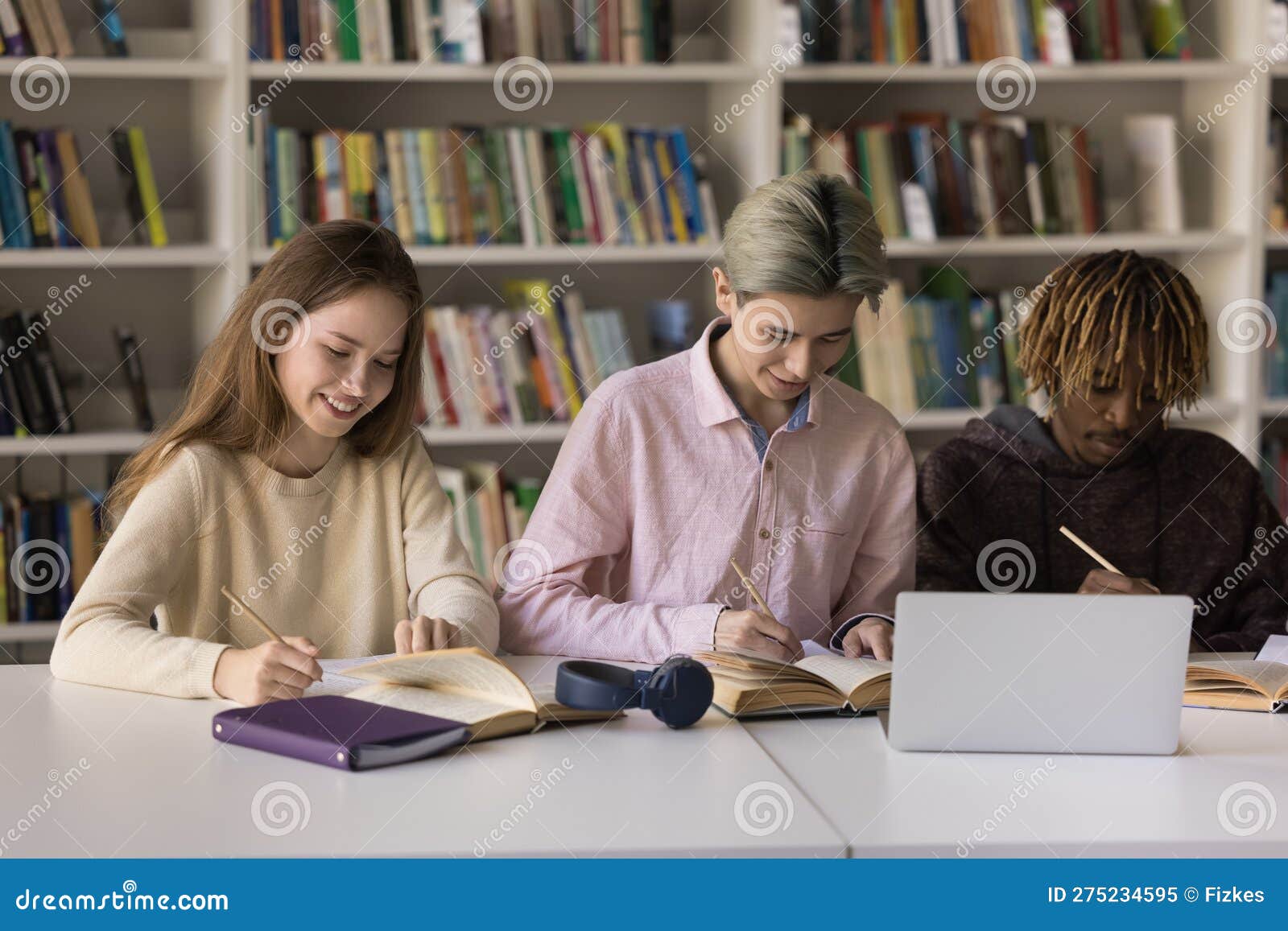 Three Diverse Students Sit Library with Laptop Do Homework Stock Image ...