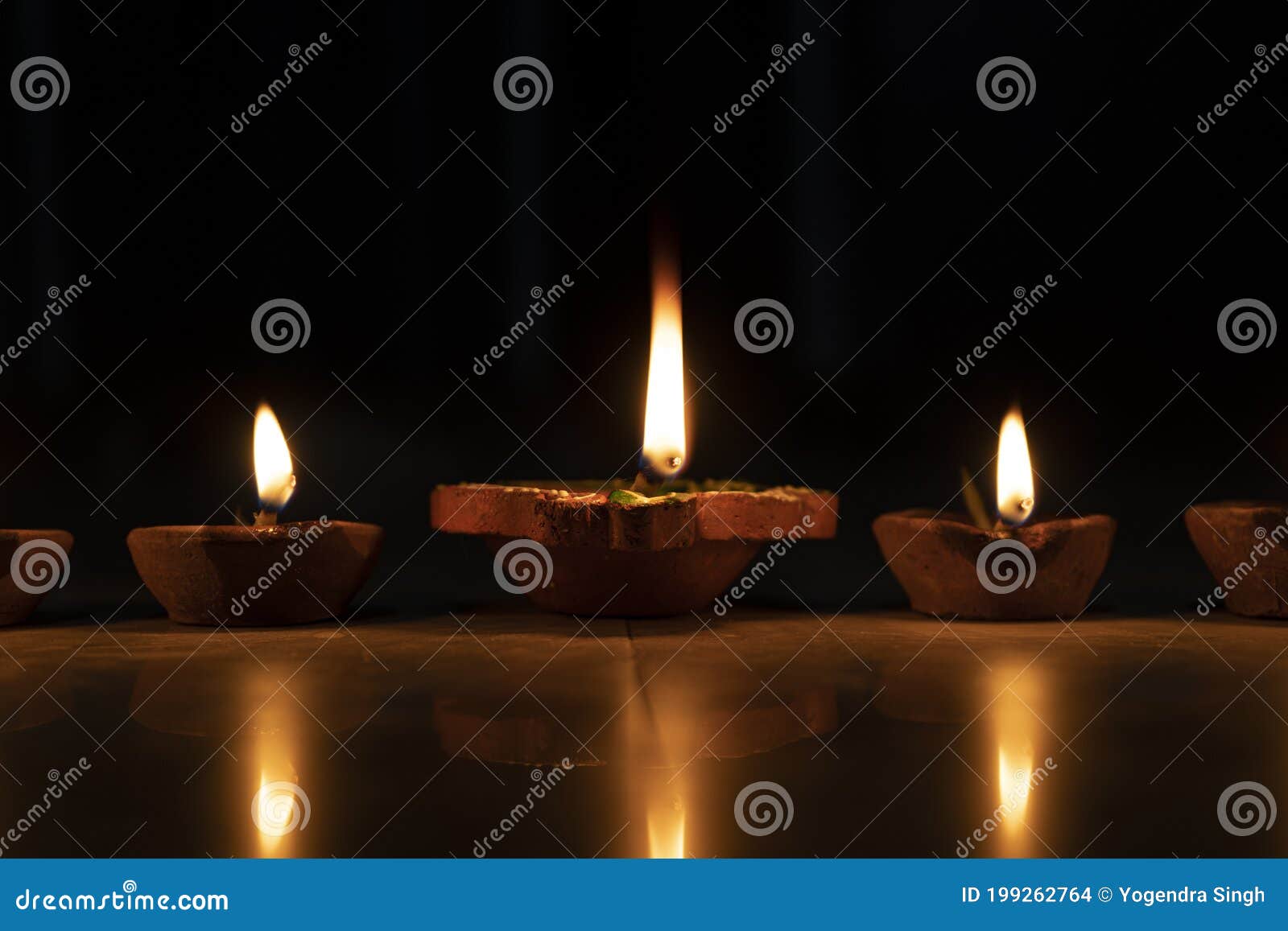 Three Diyas Kept in a Row, Celebrating Diwali in India Stock Photo ...