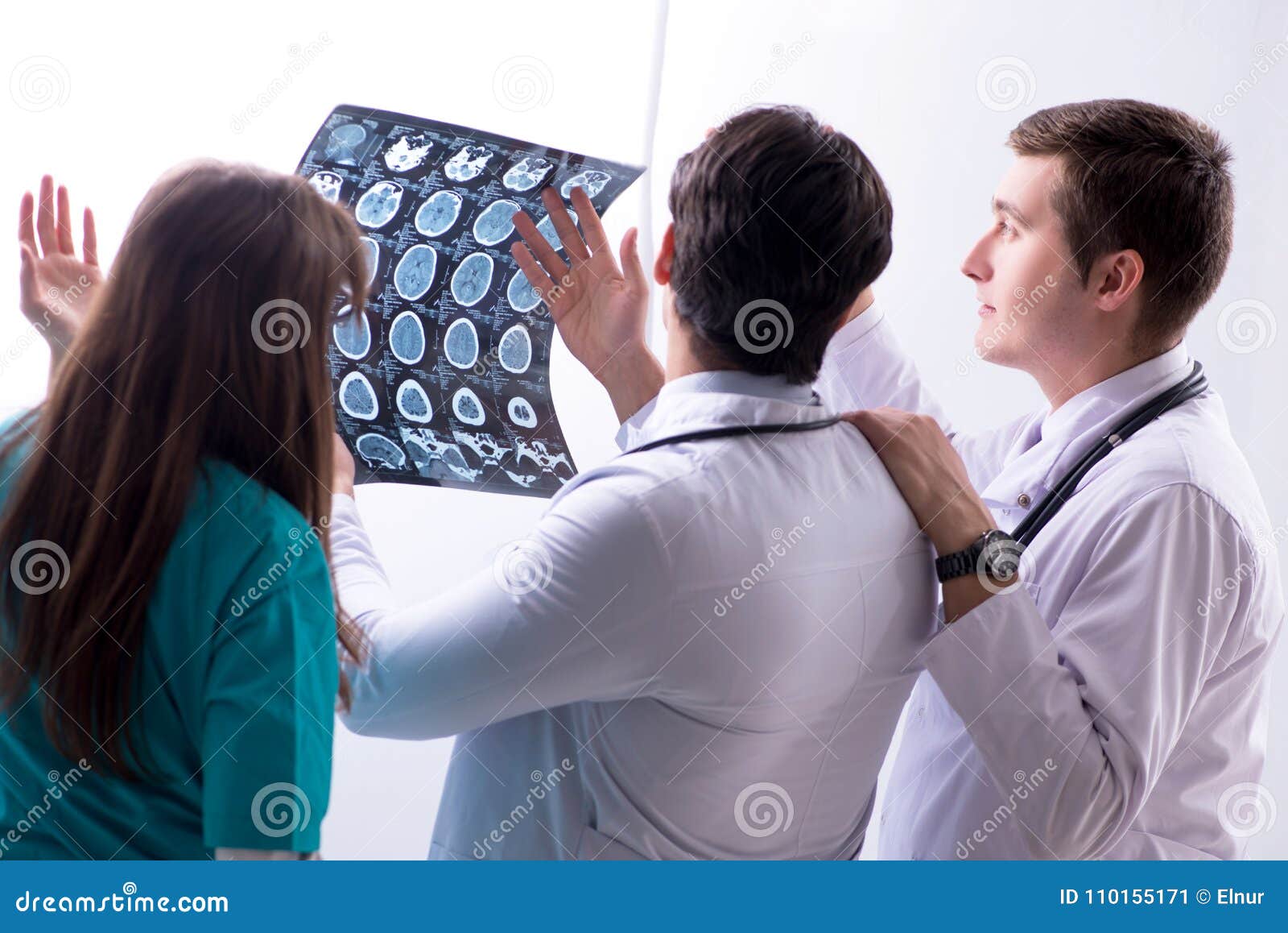 The Three Doctors Discussing Scan Results of X-ray Image Stock Image ...