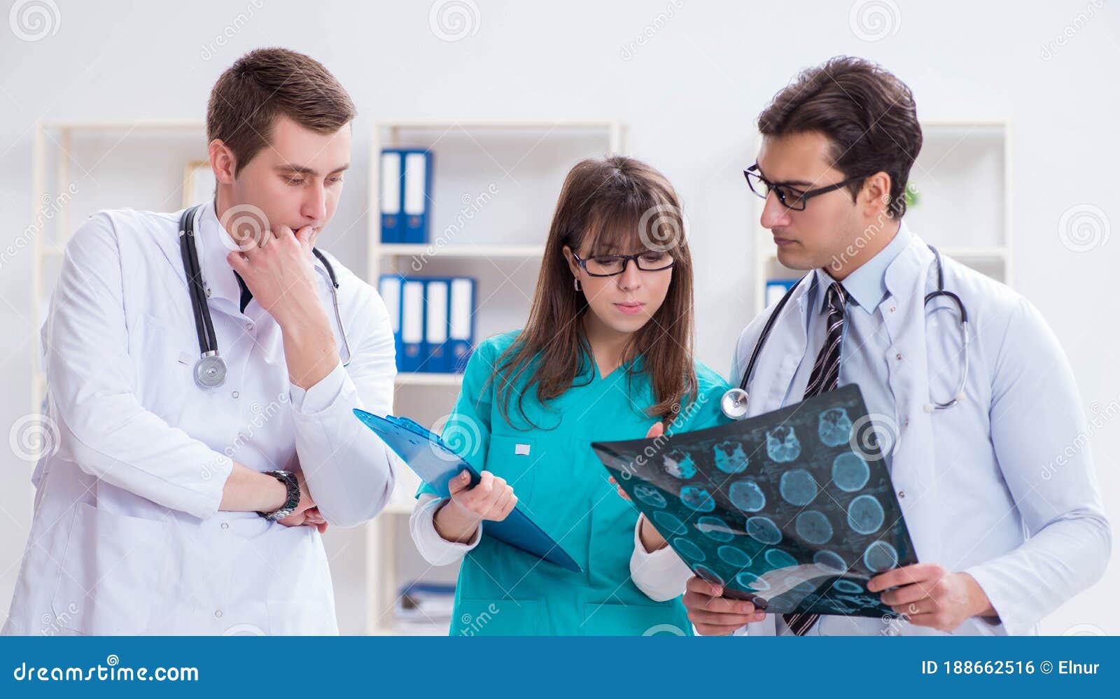 Three Doctors Discussing Scan Results of X-ray Image Stock Photo ...