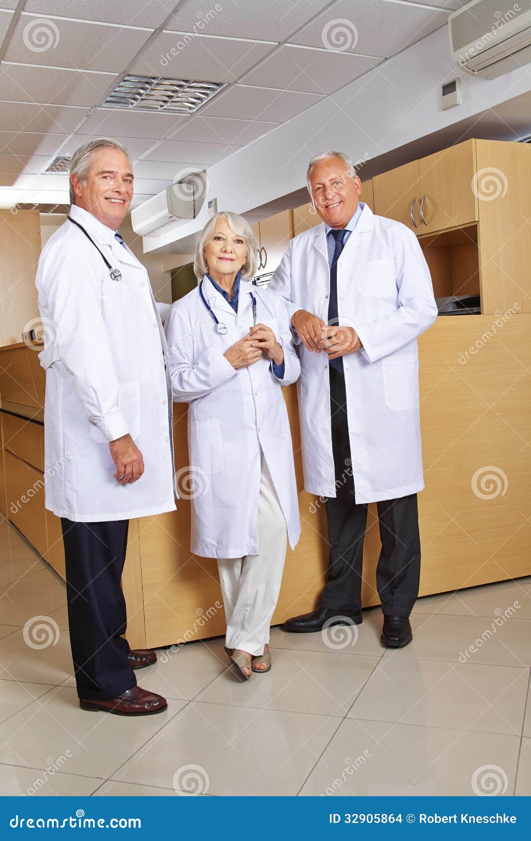 Three Doctors Standing in Hospital Stock Photo - Image of hospital ...