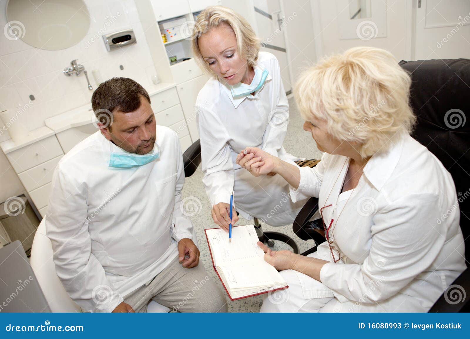 Three doctors talking stock image. Image of friendly - 16080993