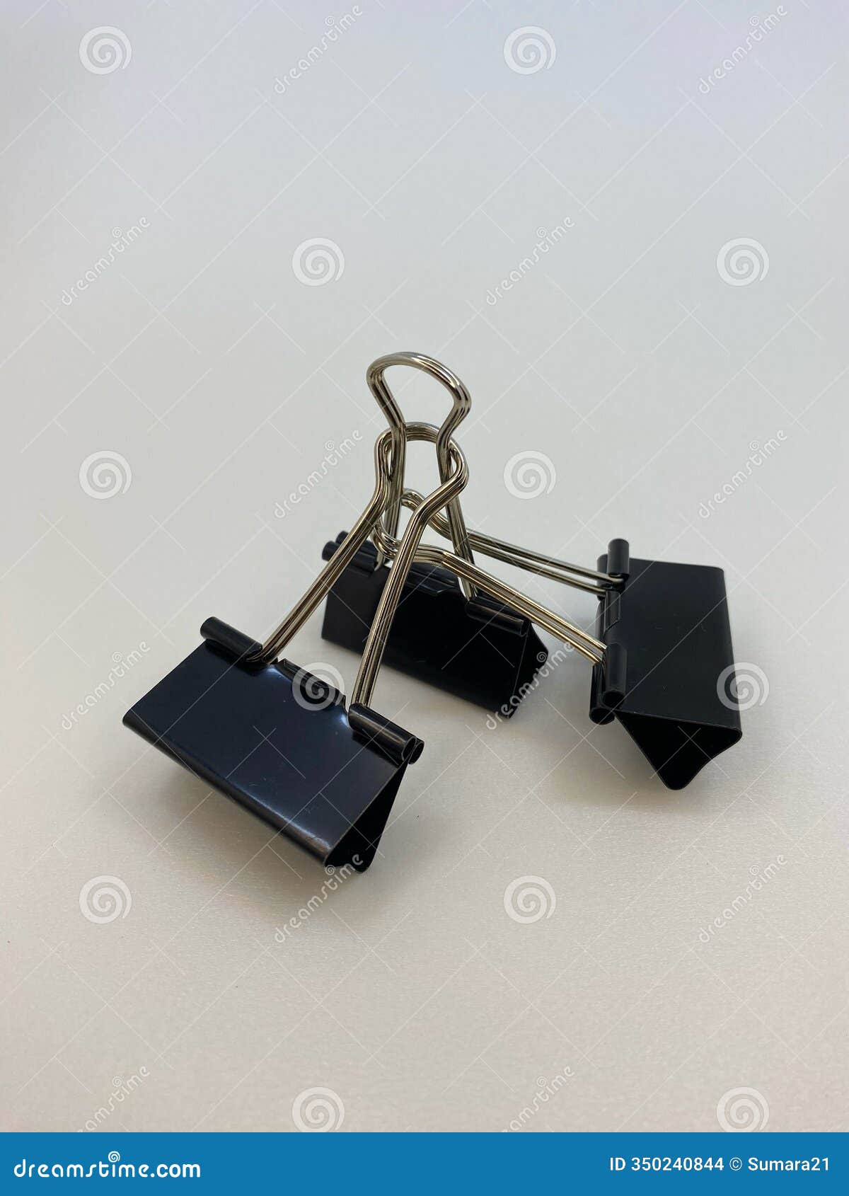 Three Document Clips in an Isolated Room Stock Photo - Image of studio ...