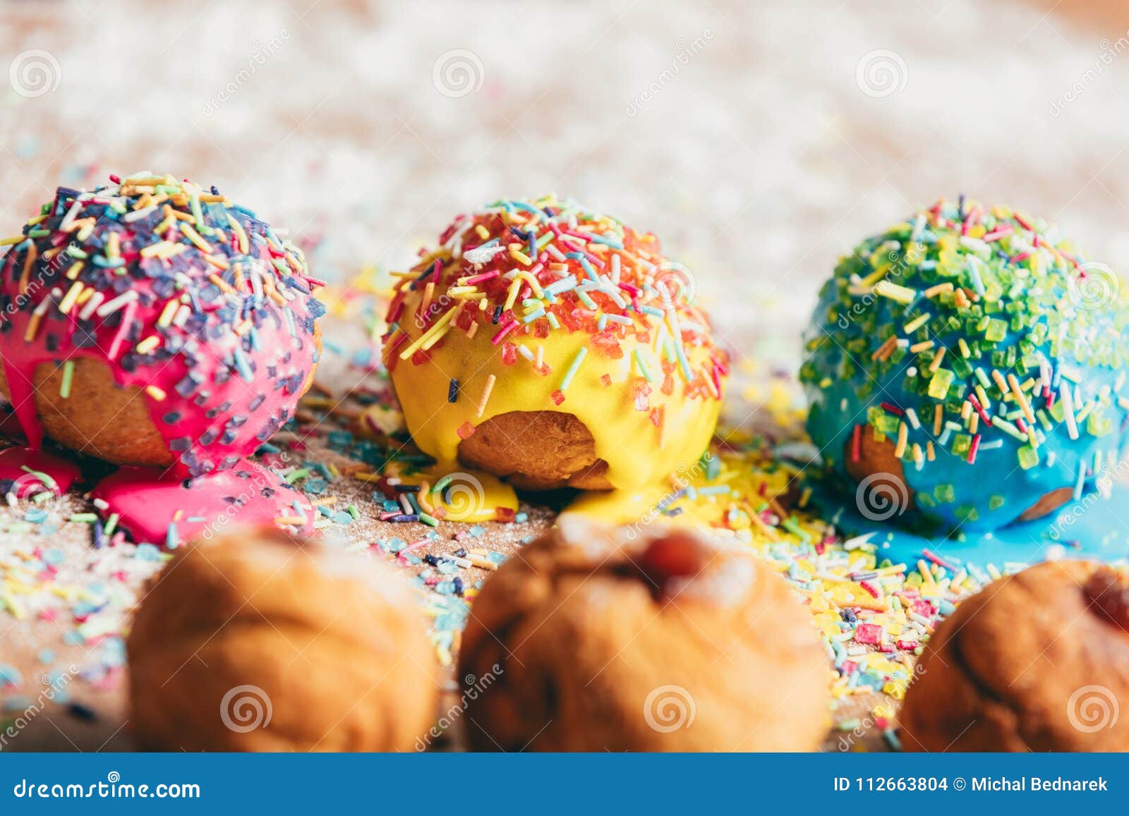 Three Donuts Laying on a Messy Kitchen Counter Stock Photo - Image of ...