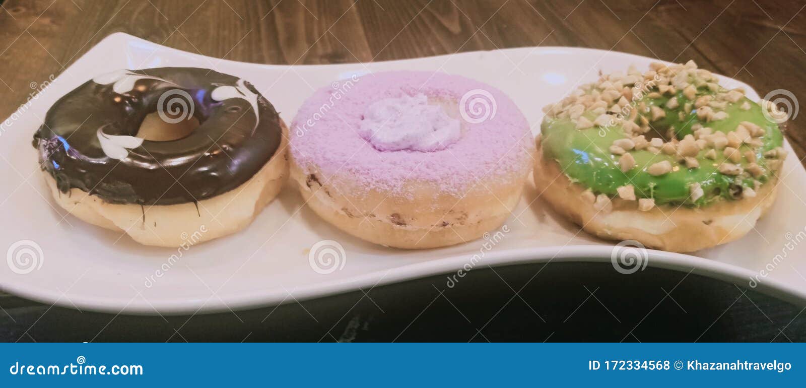 Three donuts on plate stock photo. Image of donuts, flavored - 172334568