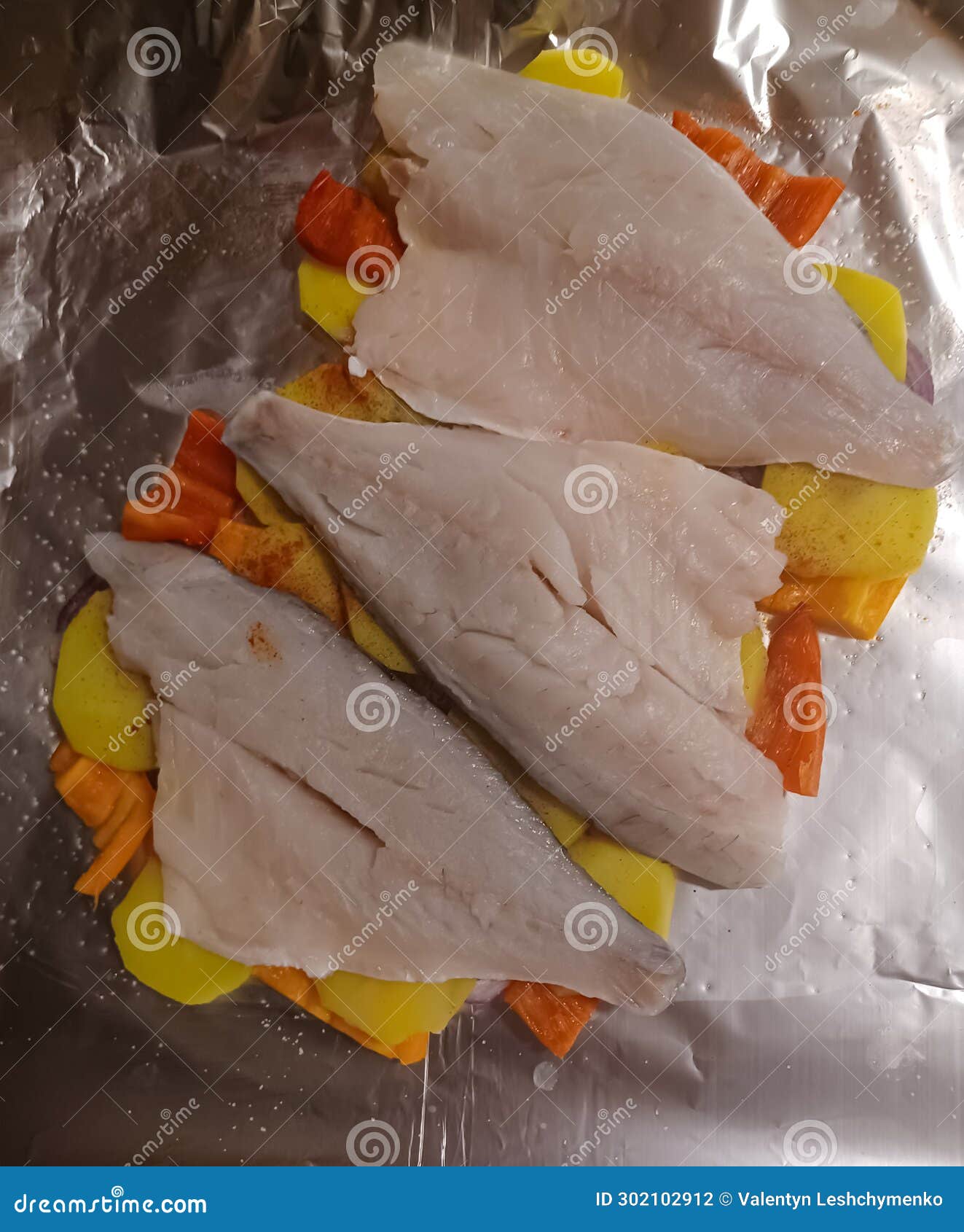 Three Dorado Fillets are Placed on Foil with Vegetables Stock Photo ...